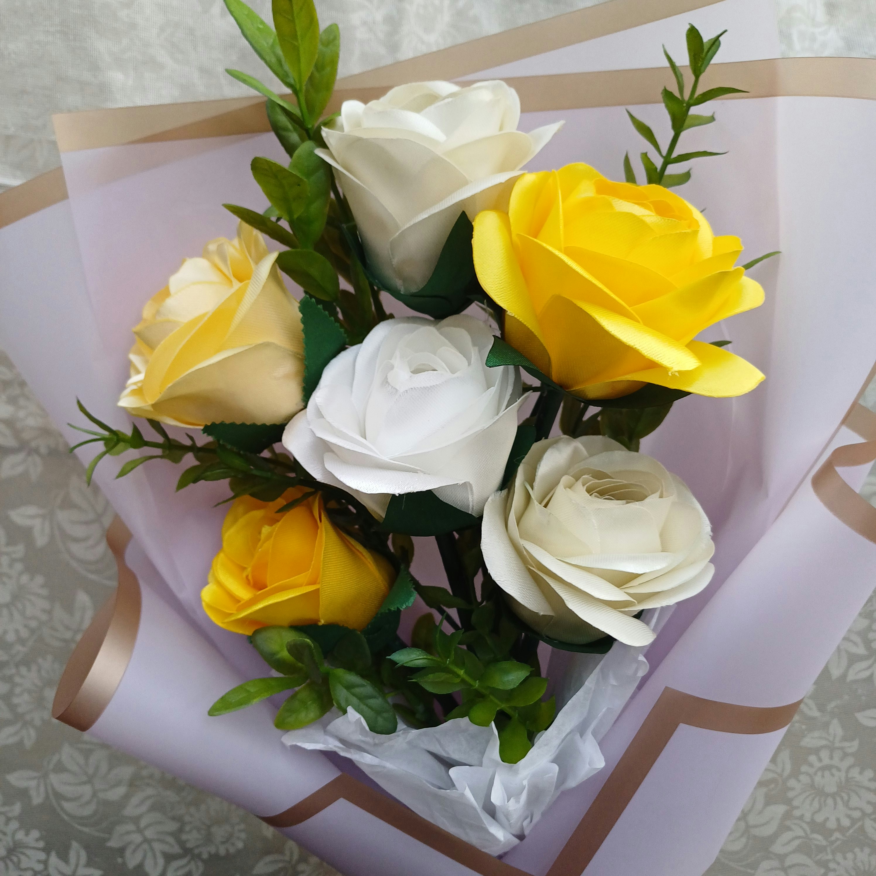 Pastel Roses in Soft Wrapping: A Delicate Bouquet in Bloom