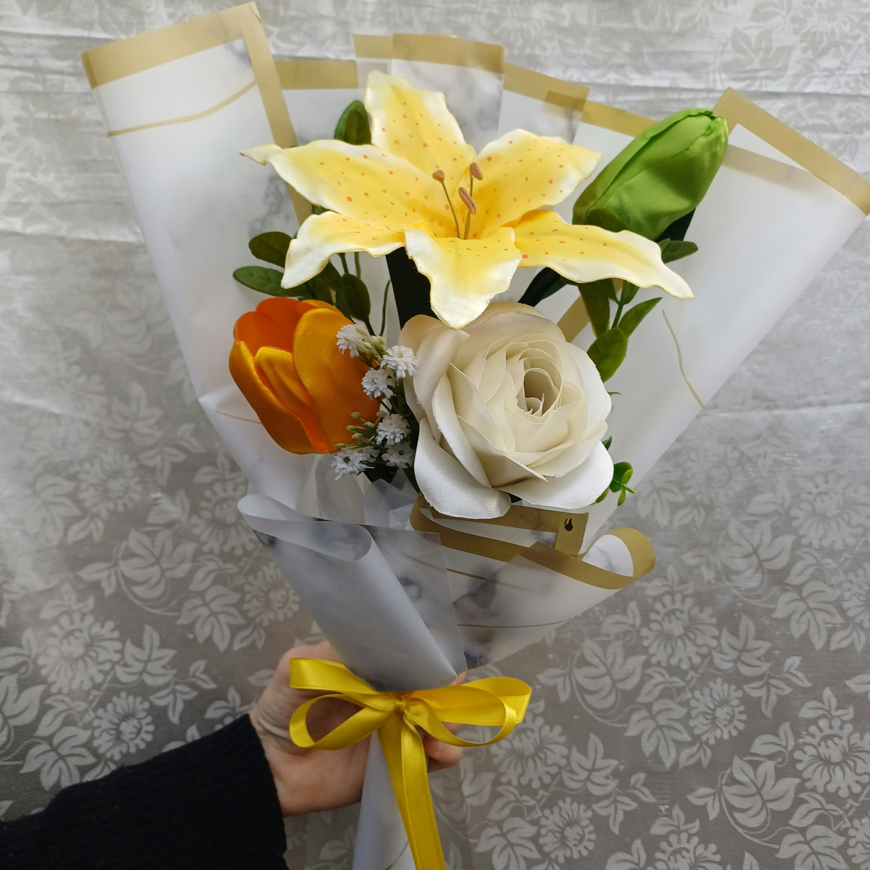 Bouquet in Hand: A Whisper of Pastel Lilies and Roses wrapped in Elegant Paper
