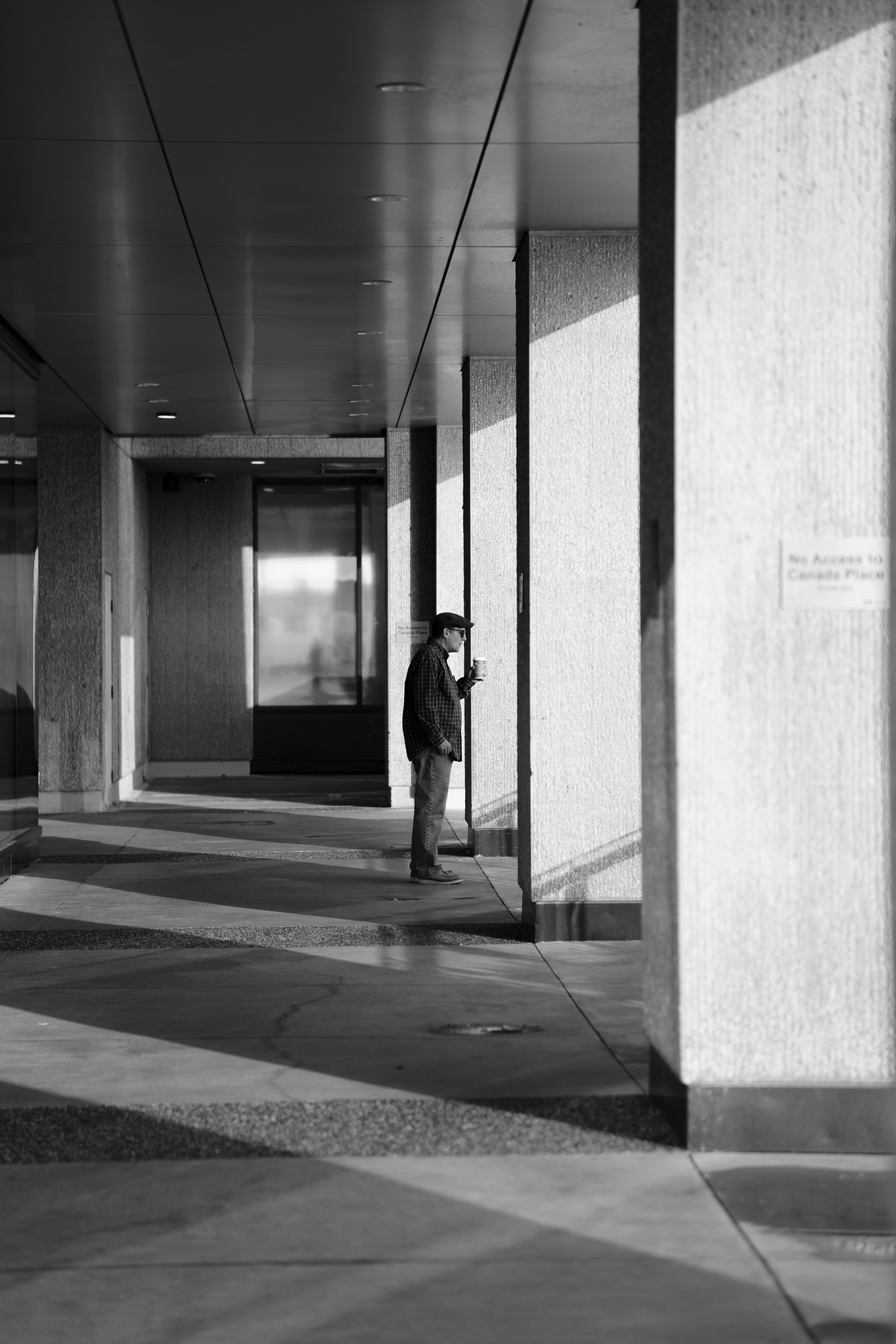 Man in Checks: A Quiet Moment at the Colonnade