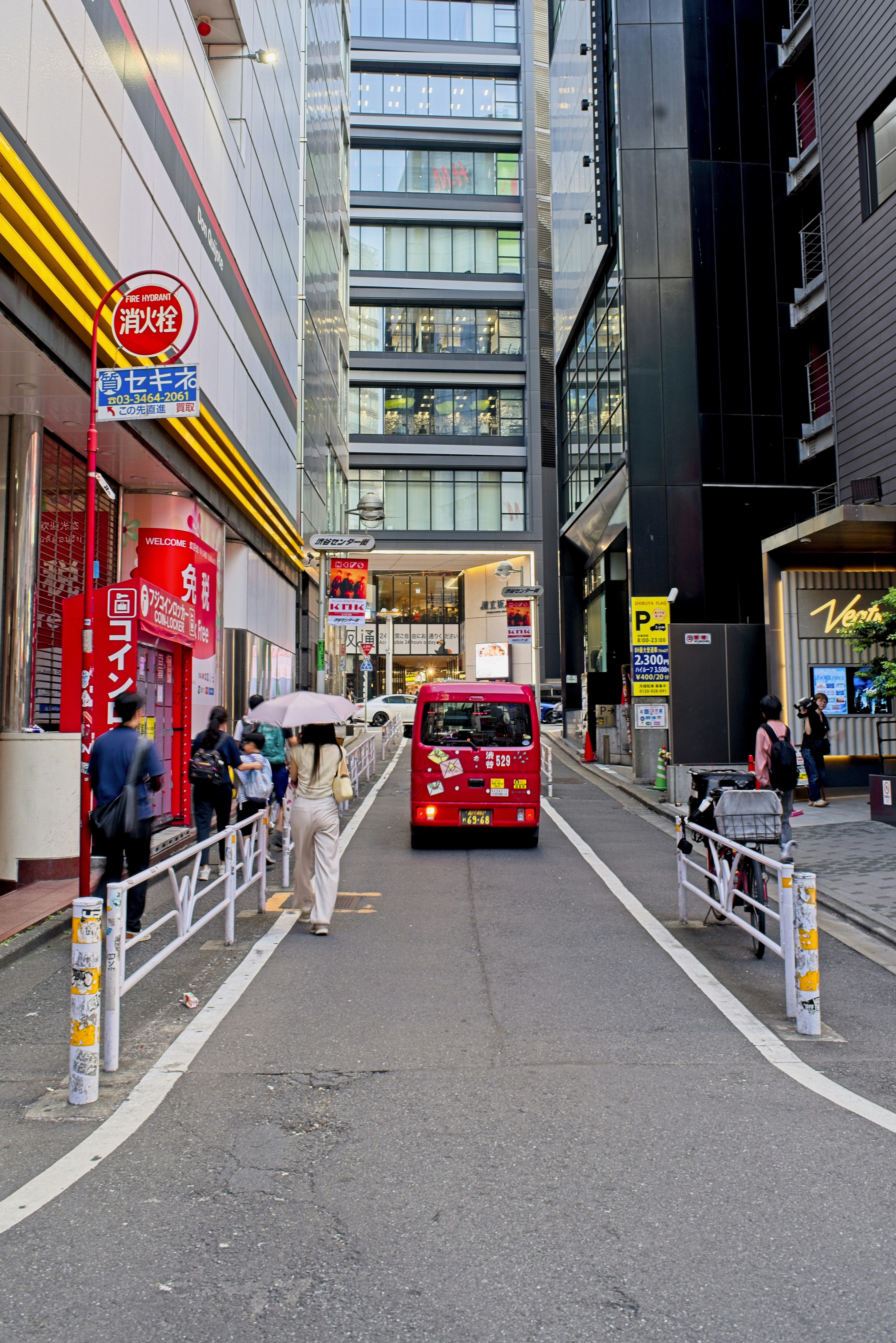 Red City Bus in the Narrow Street of Neon Tokyo