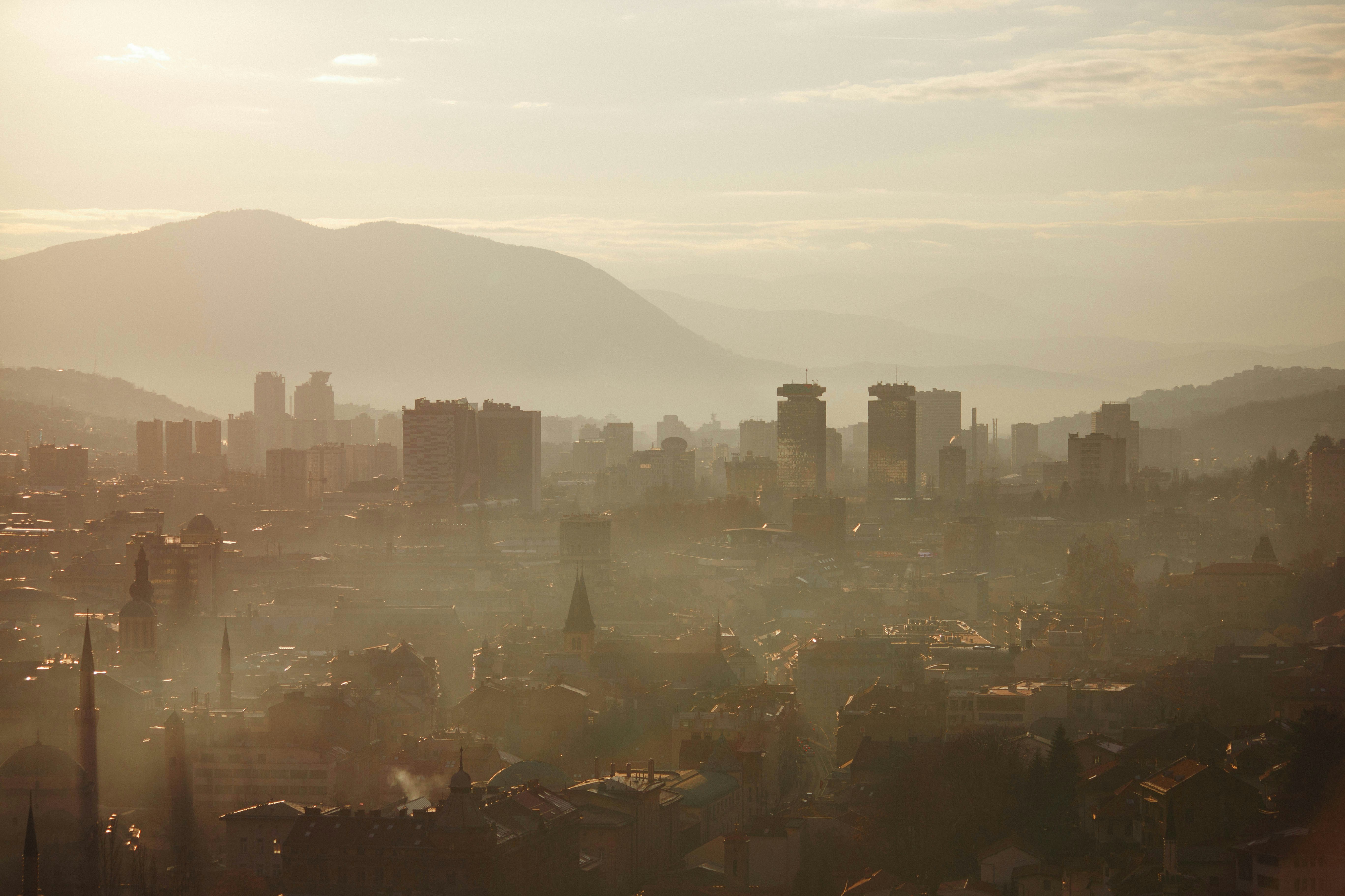 Hazy Dawn Over a Silhouette City