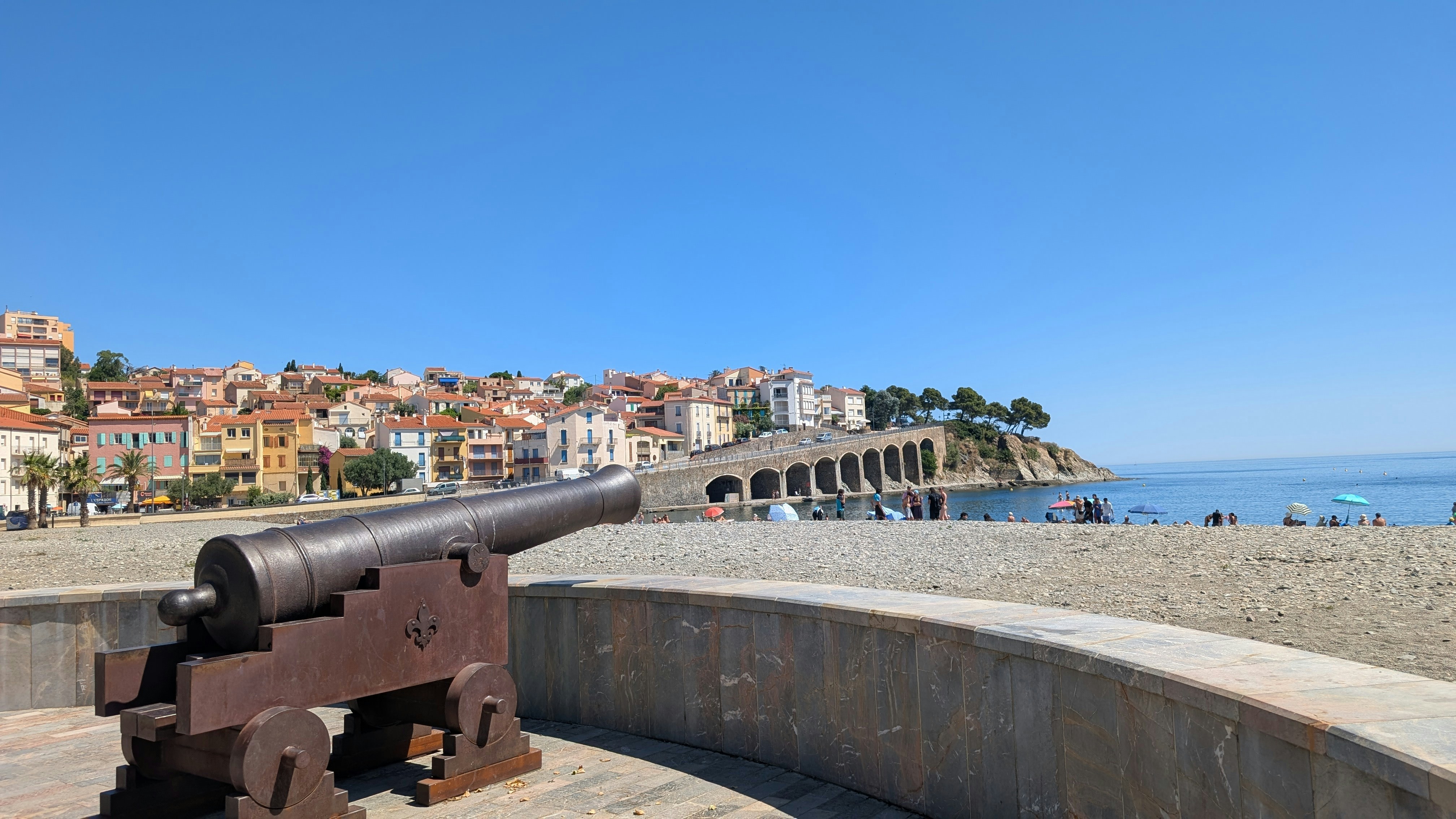 Harbor Canon Overlooking a Sunny Riviera