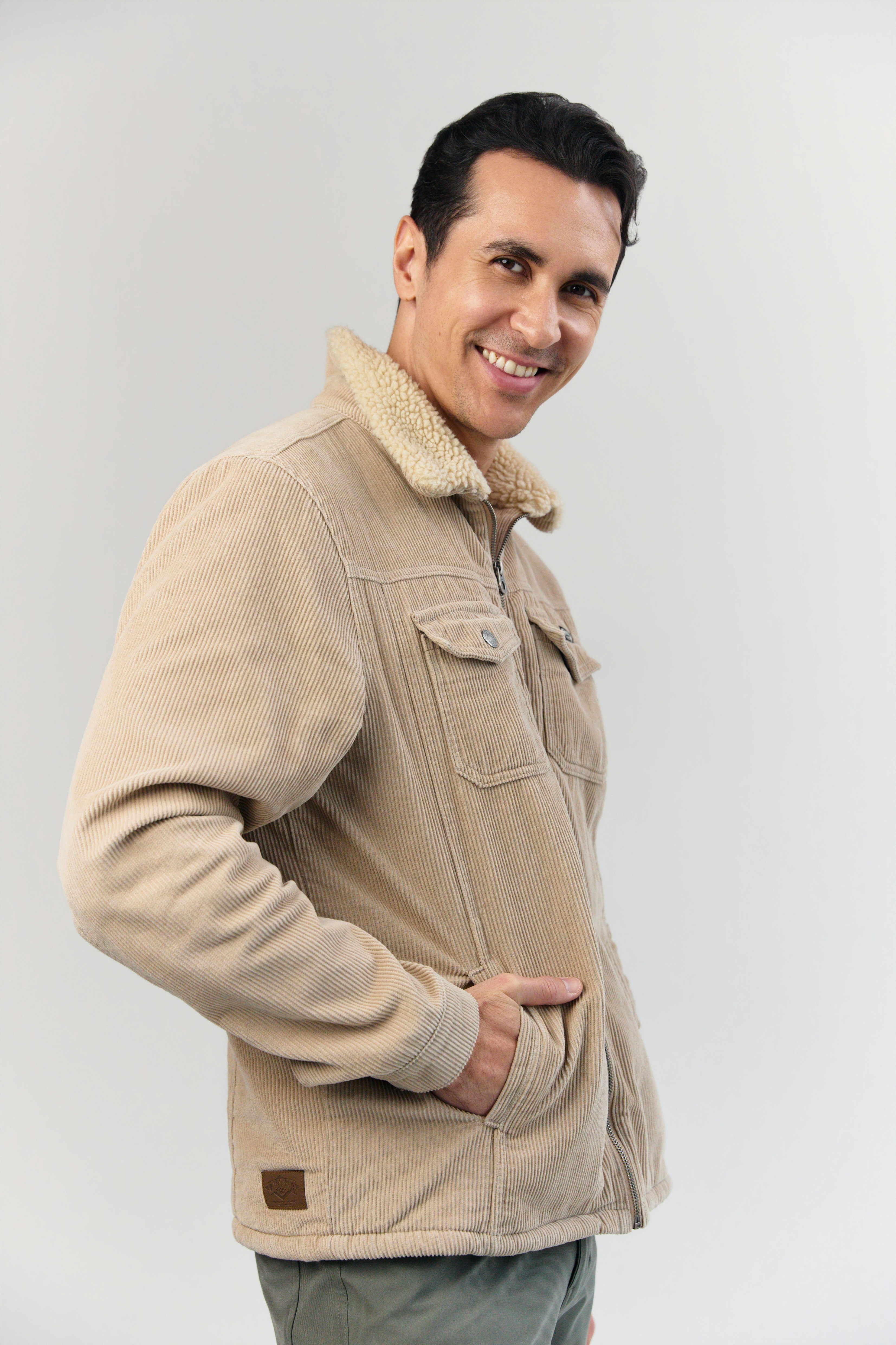 Warm fleece, cool vibe: portrait of a confident man in tonal beige
