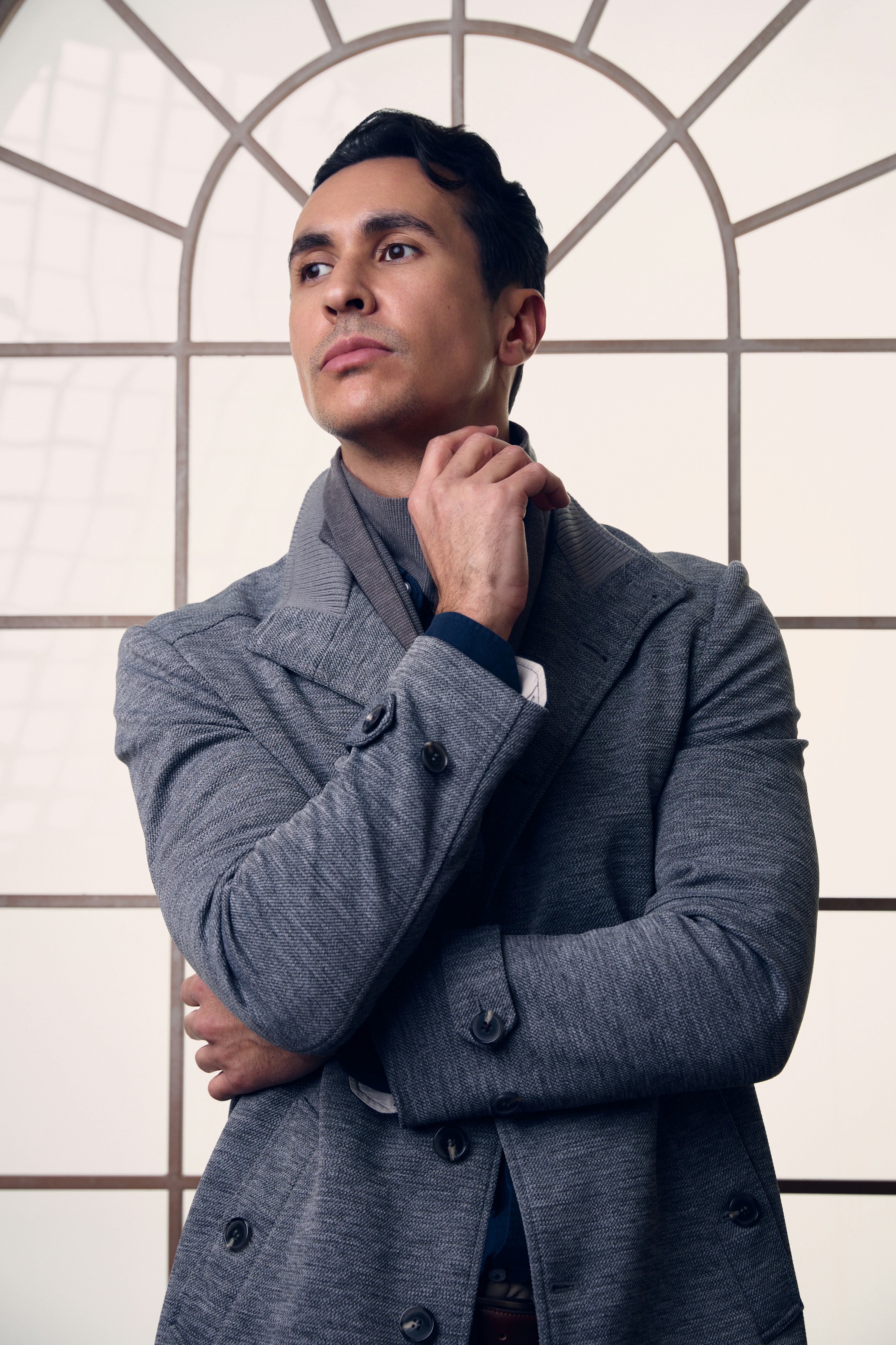 Portrait of Quiet Confidence in a Grey Coat