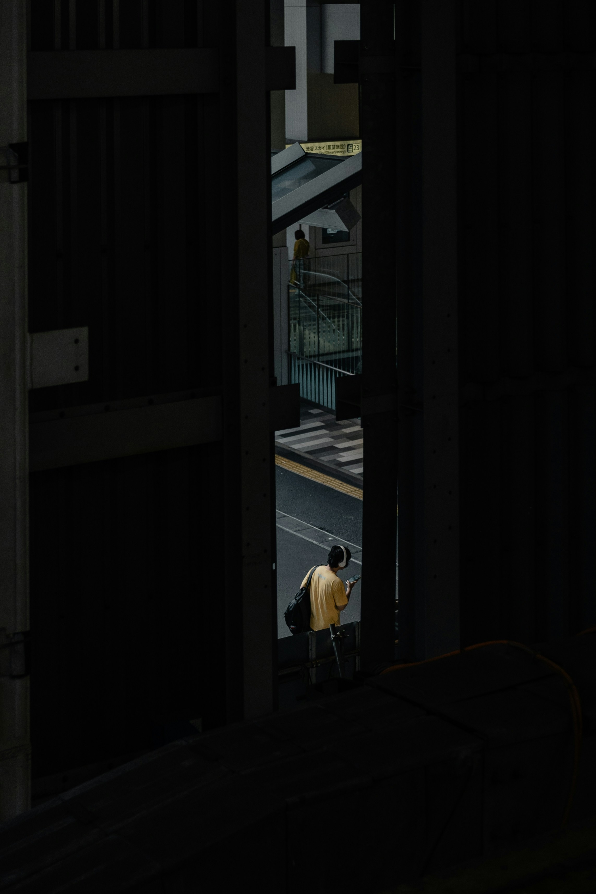 Midnight in the Columns: A Solo Figure at the Edge of the Platform