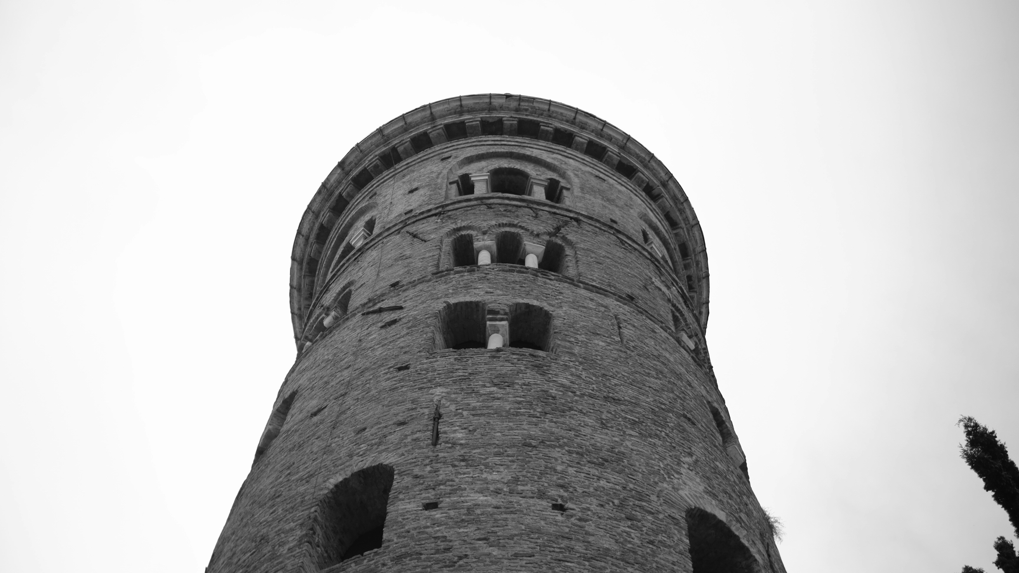 Towering Echoes: A Tilted Bell-Tower Reaches Toward the Sky
