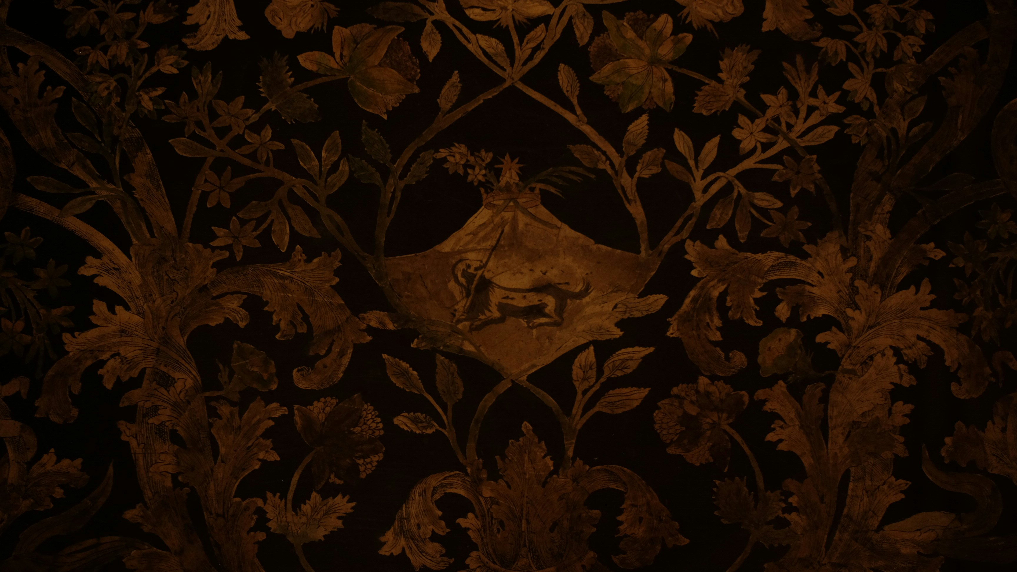 Ornate Tapestry Portrait: A Hidden Crest Framed by Golden Vines