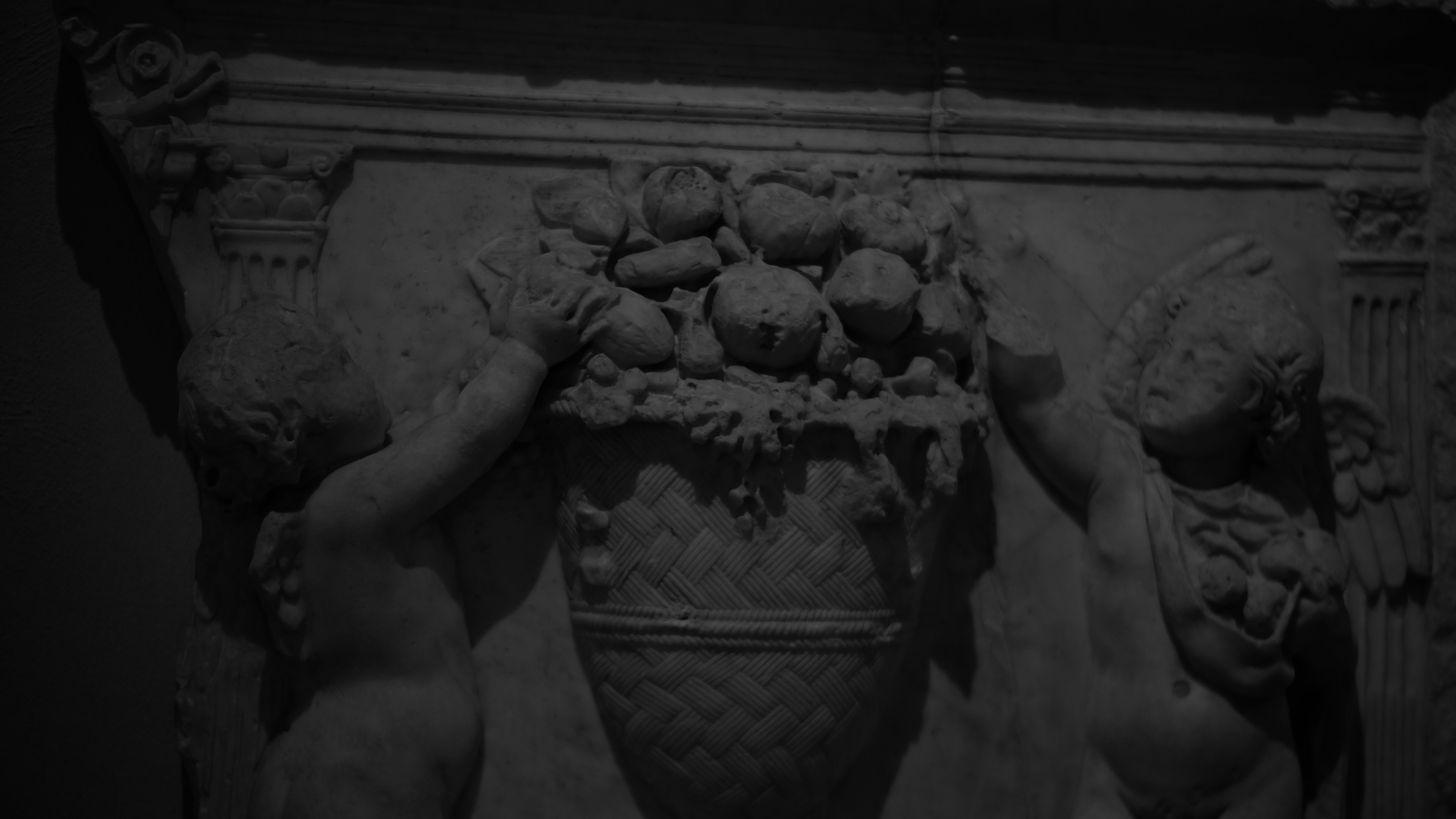 Relief Sculptures: Hands Bearing a Vase of Fruit