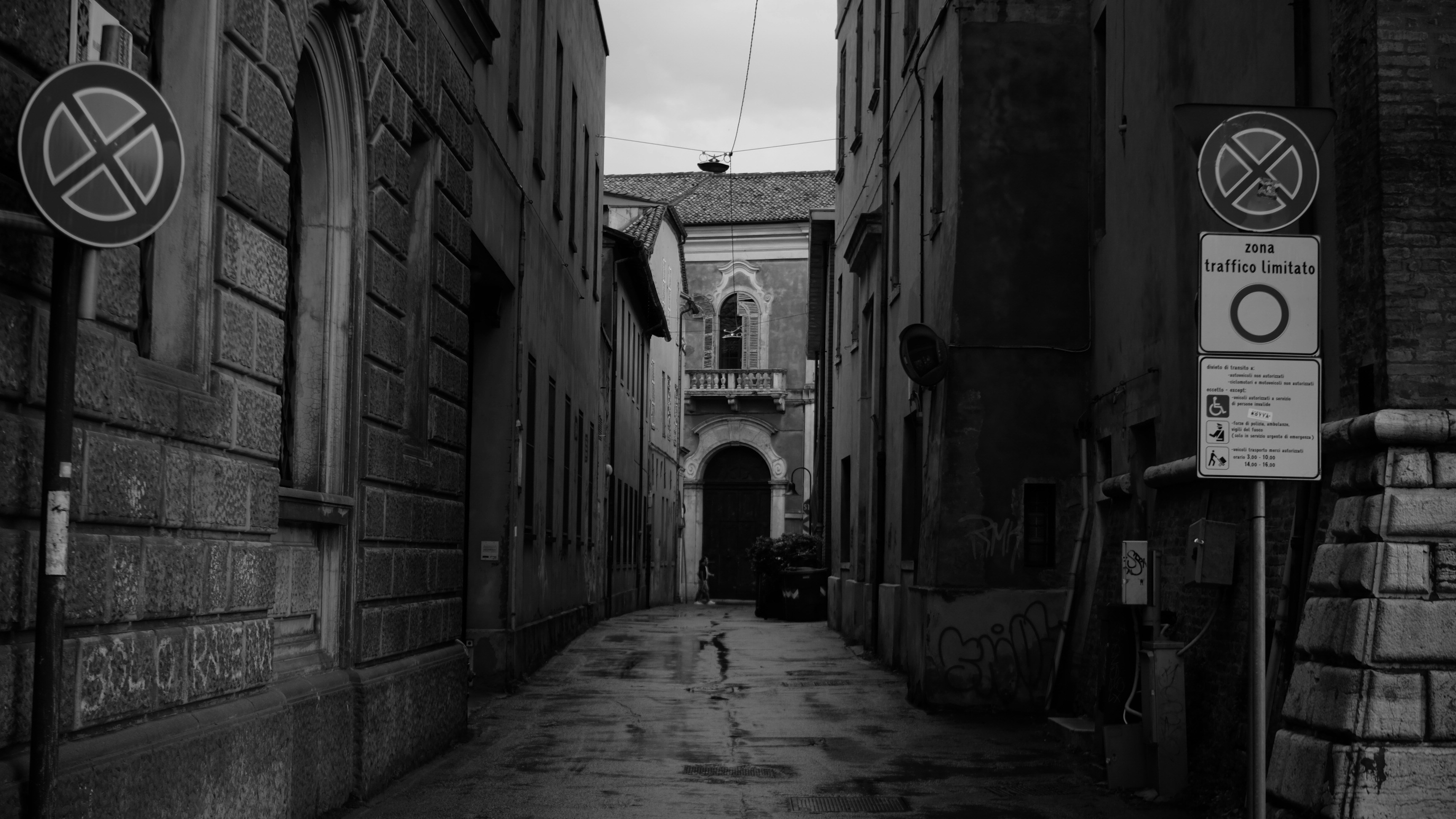 Narrow Alley Toward a Gilded Arch