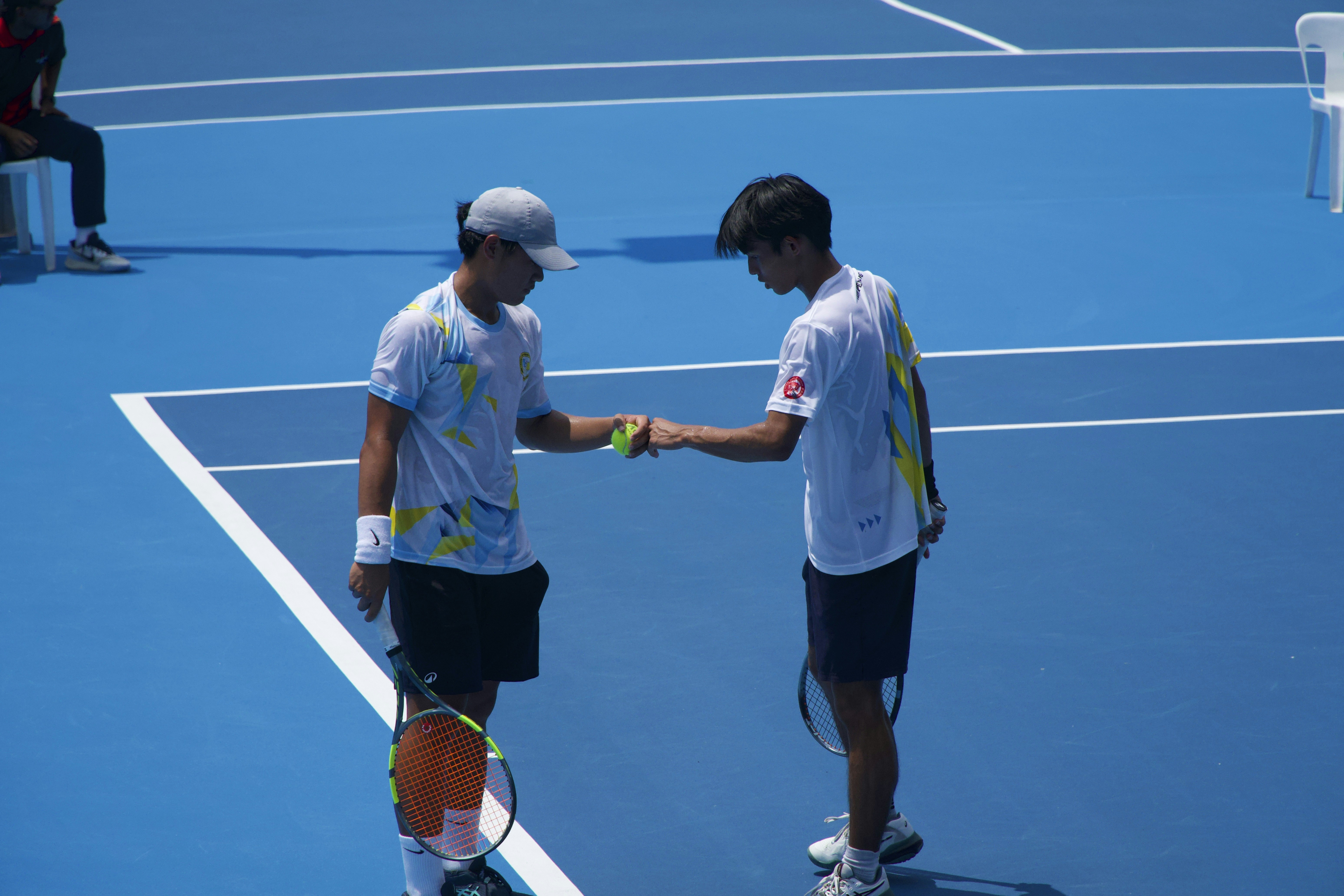 Handshake on a Bright Tennis Court