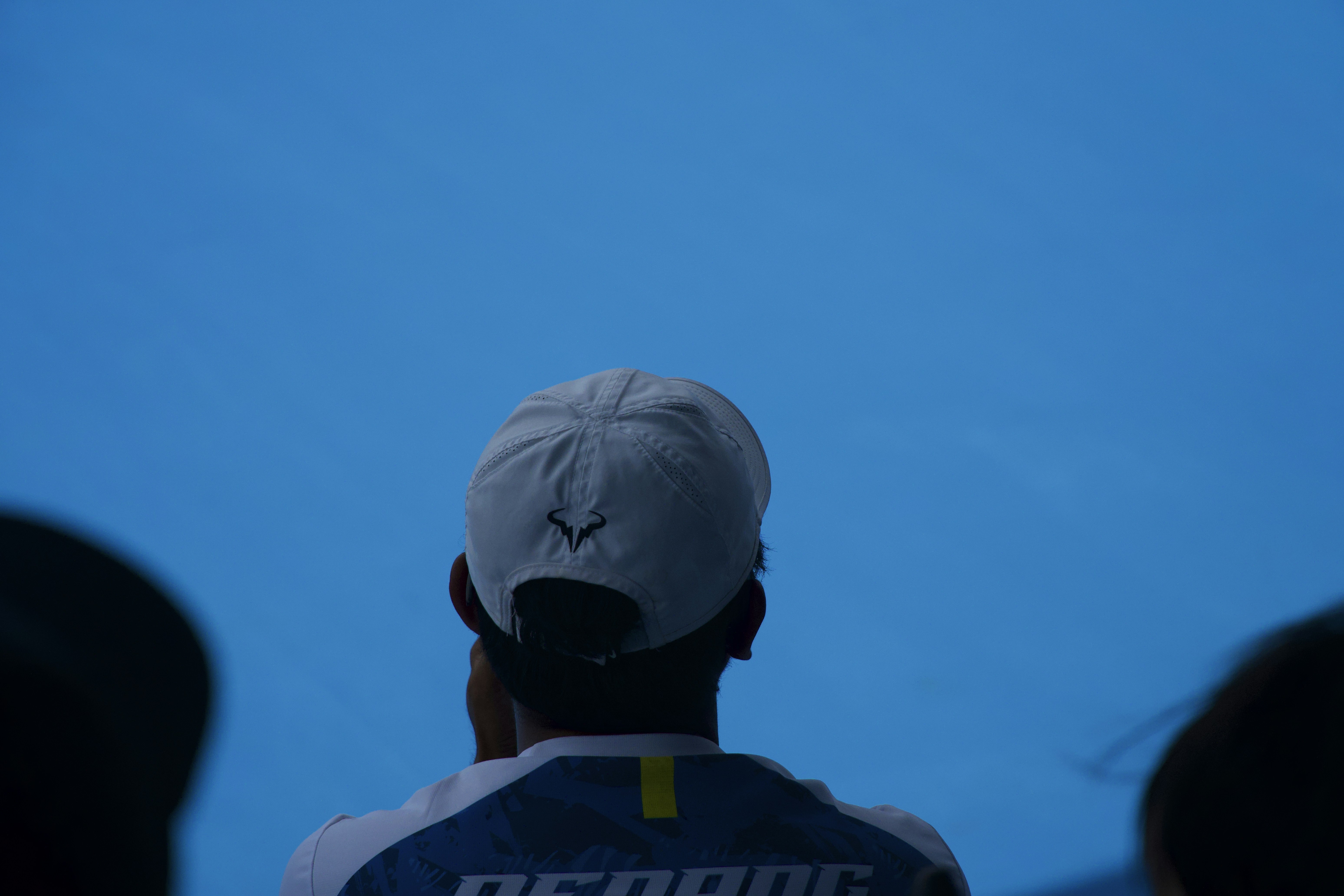 Silhouette of a Rider Under a Bright Sky