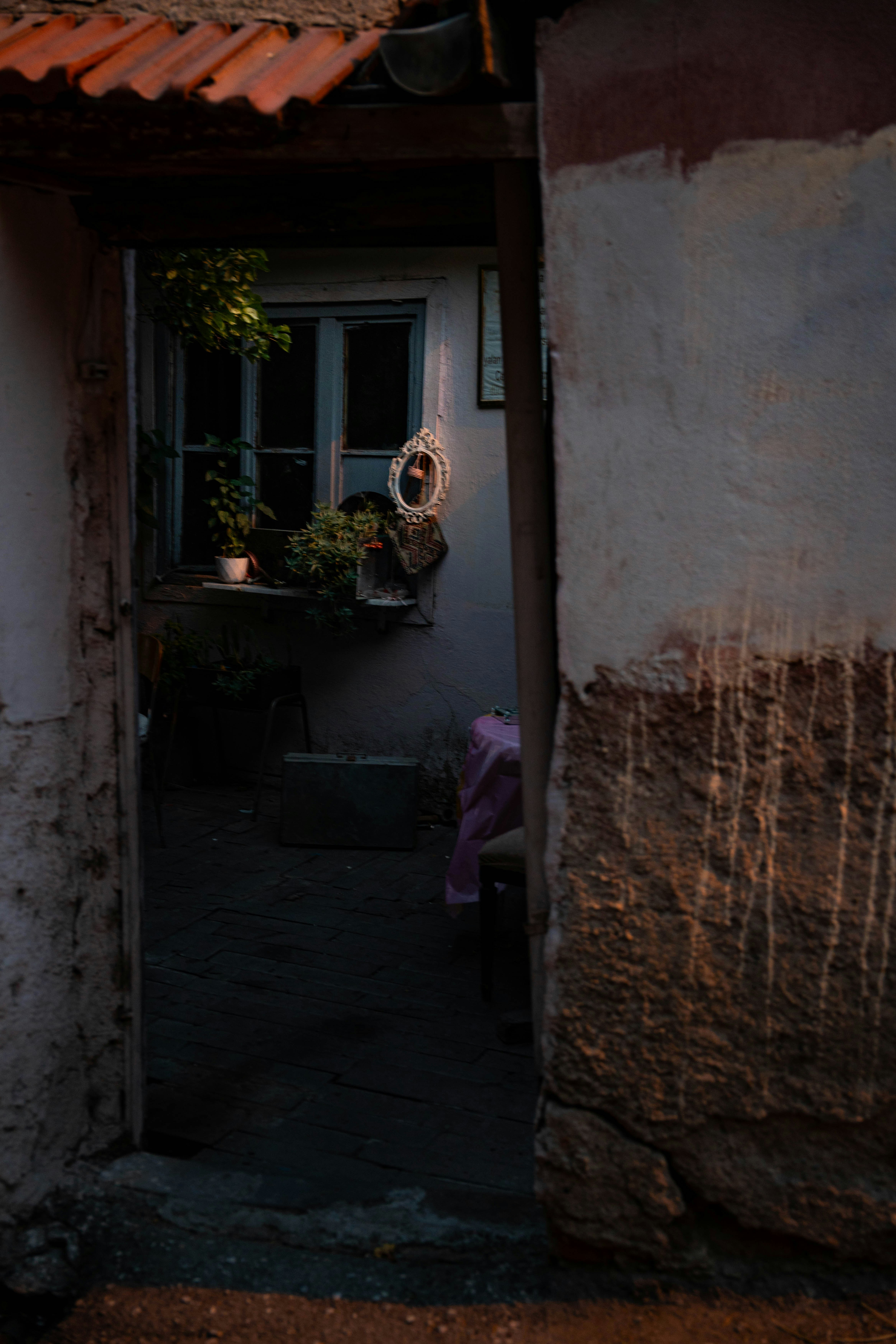 Along the Threshold: A Quiet Interior Bordered by Weathered Walls