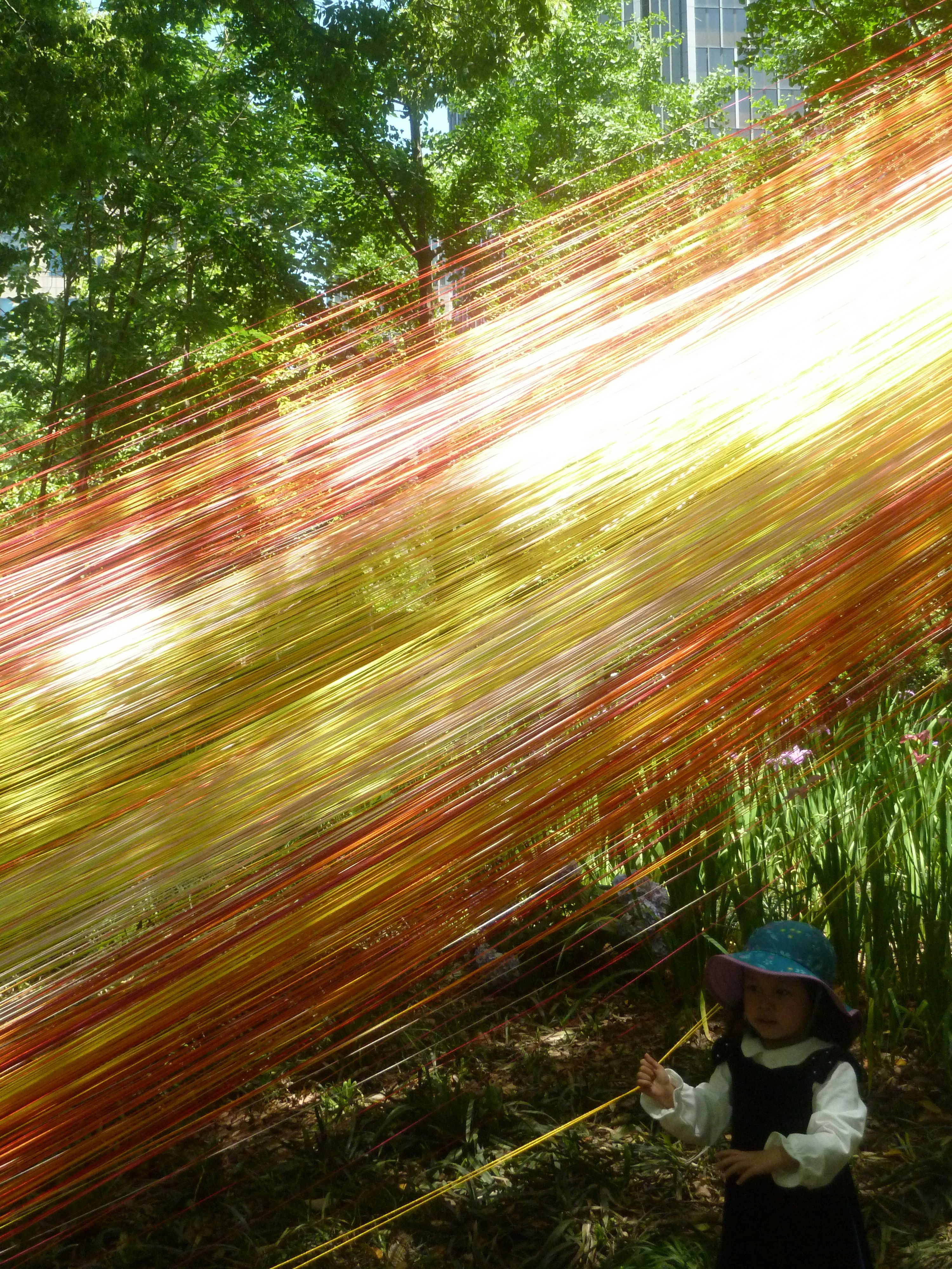 Sunlit Whorl: A Child in a Burst of Windward Color