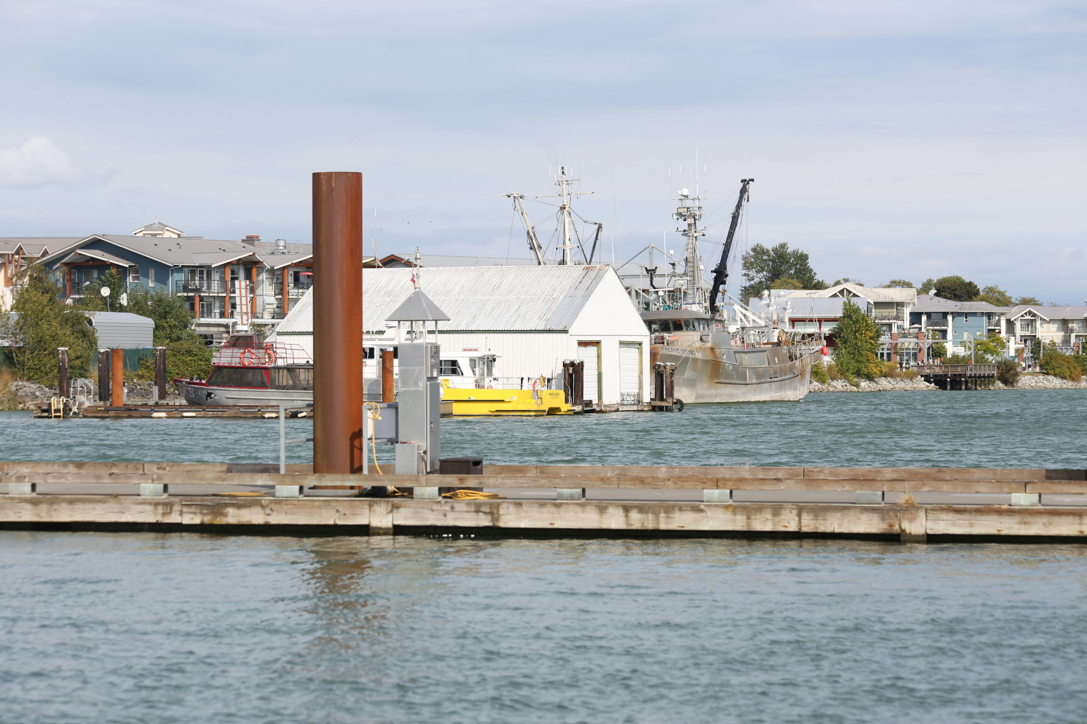 Industrial Pier and Coastal Boats at Quiet Harbor