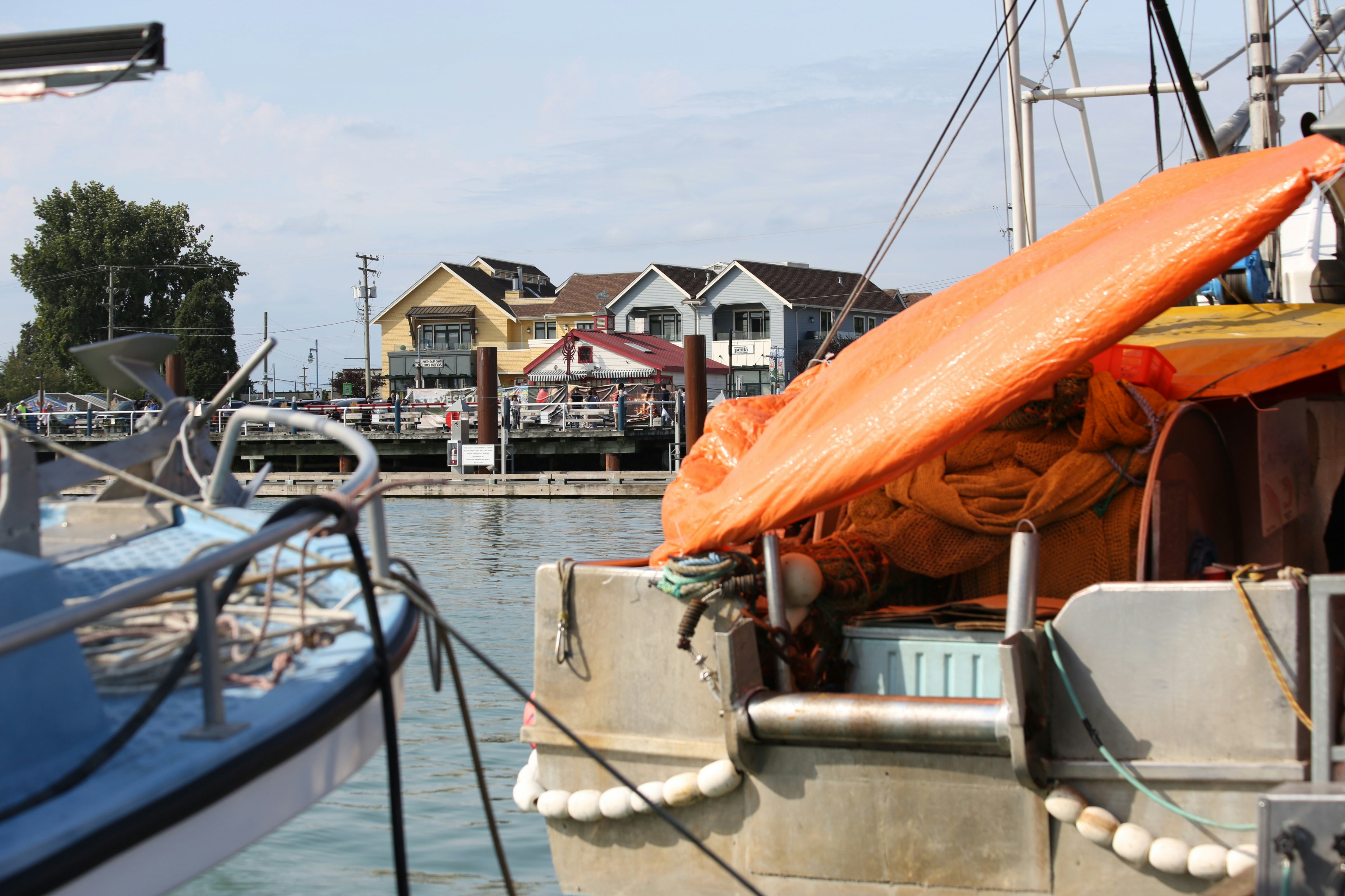 Harbor Workshop: Orange Sail and Dockside Boats