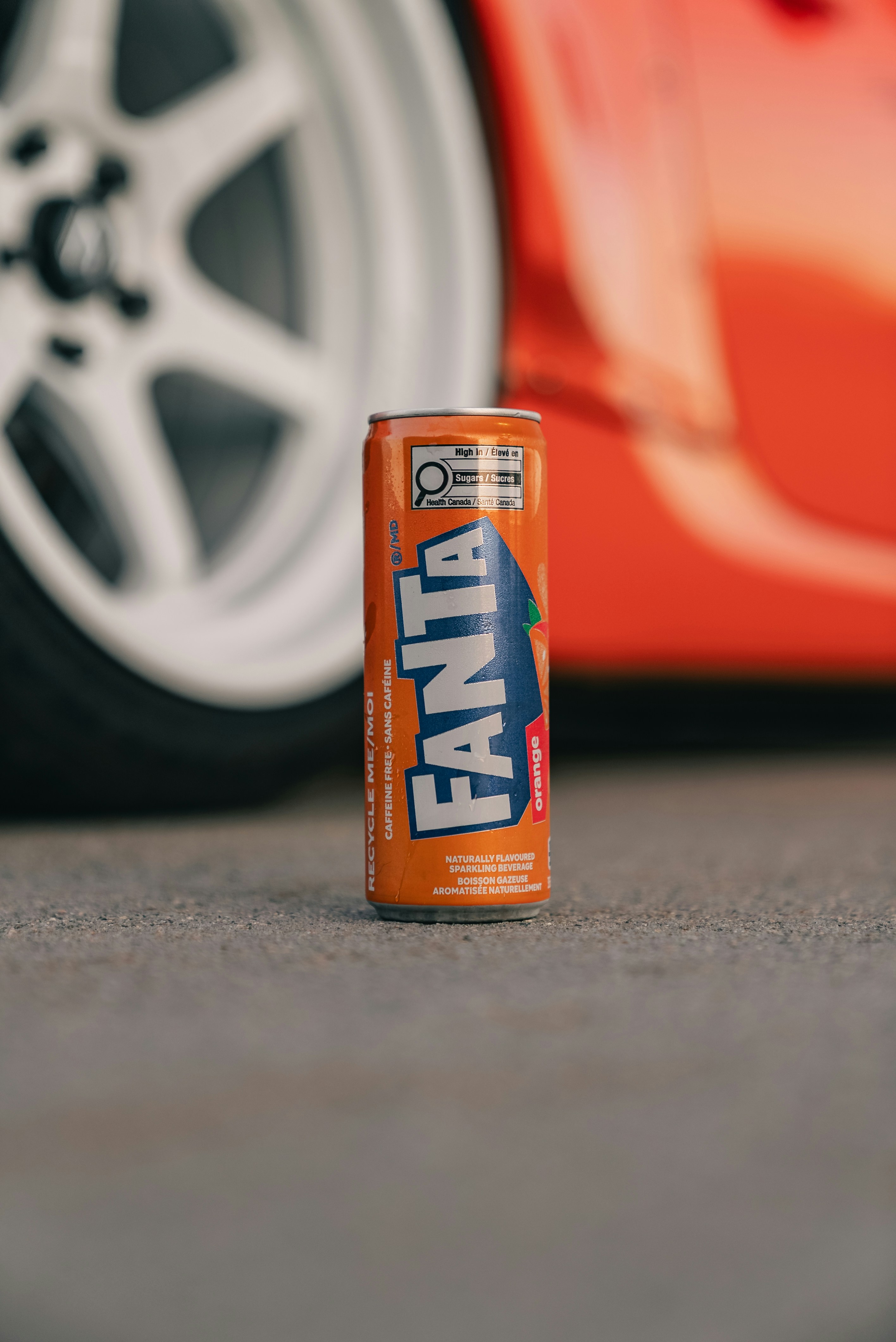 Orange Fizz, Concrete Focus: A Can of FANTA Standing Proud