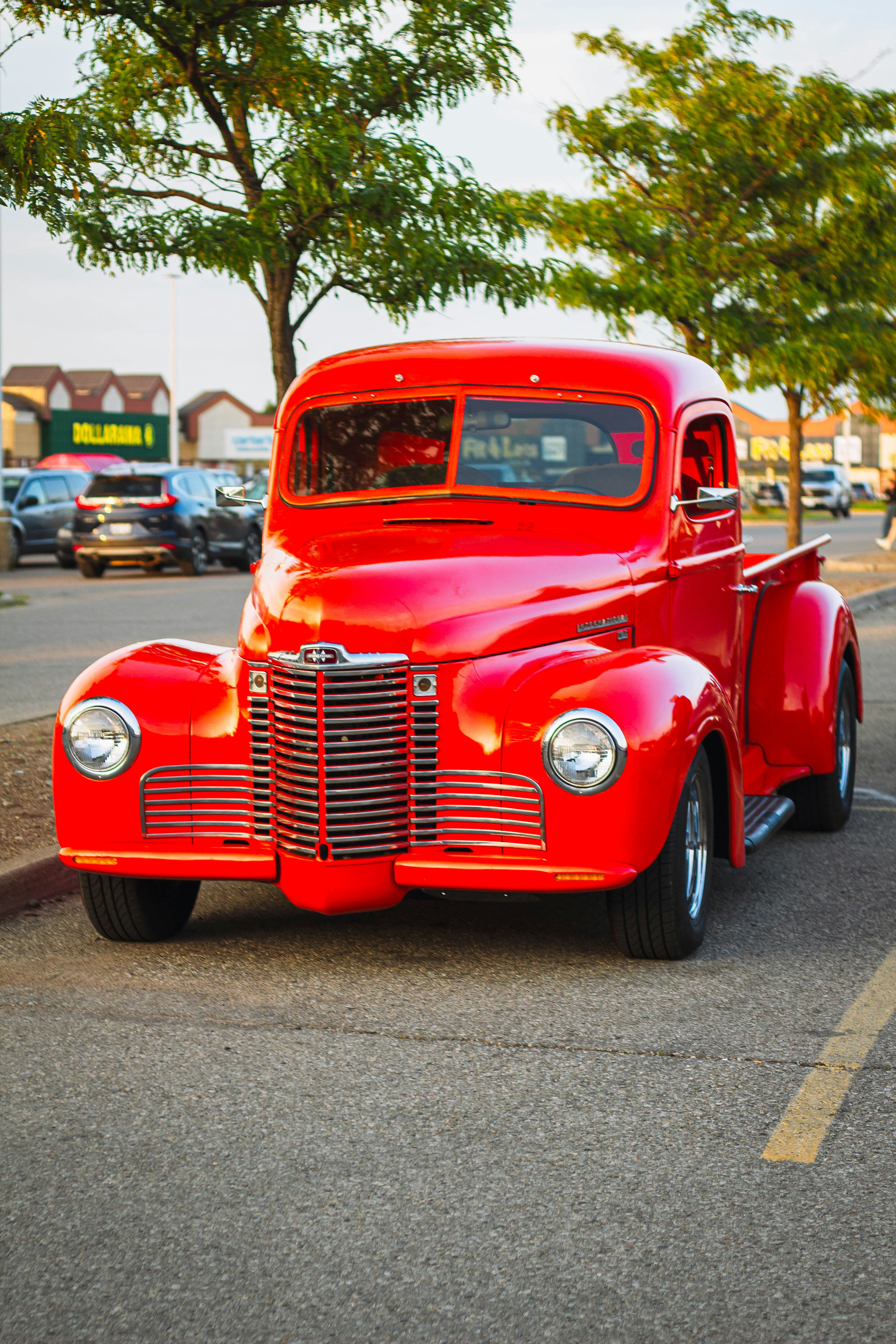 Chrome and Crimson: A Classic Pickup in the Parking Lot Spotlight