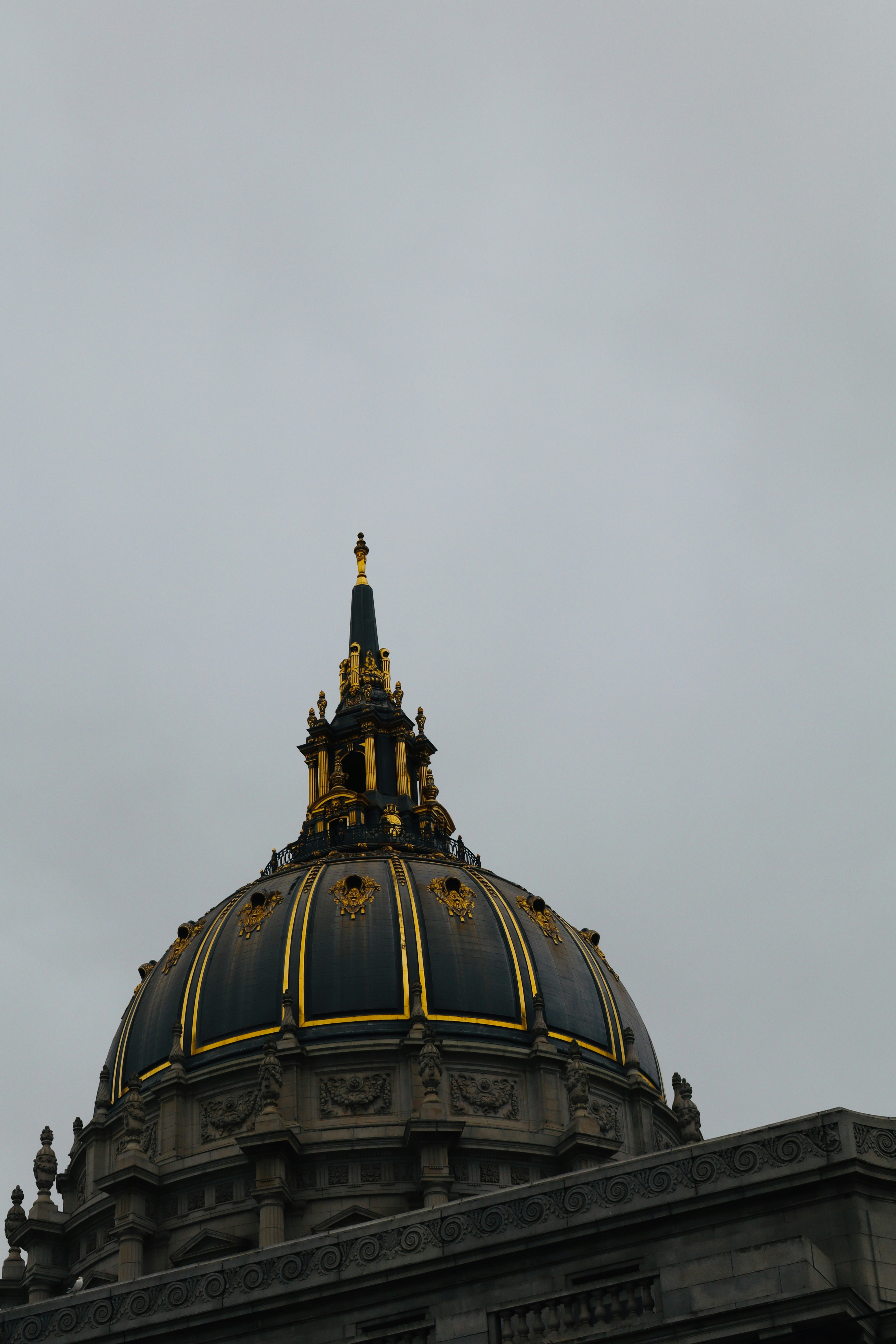 Golden Crowned Dome Rises Above Stone Carvings