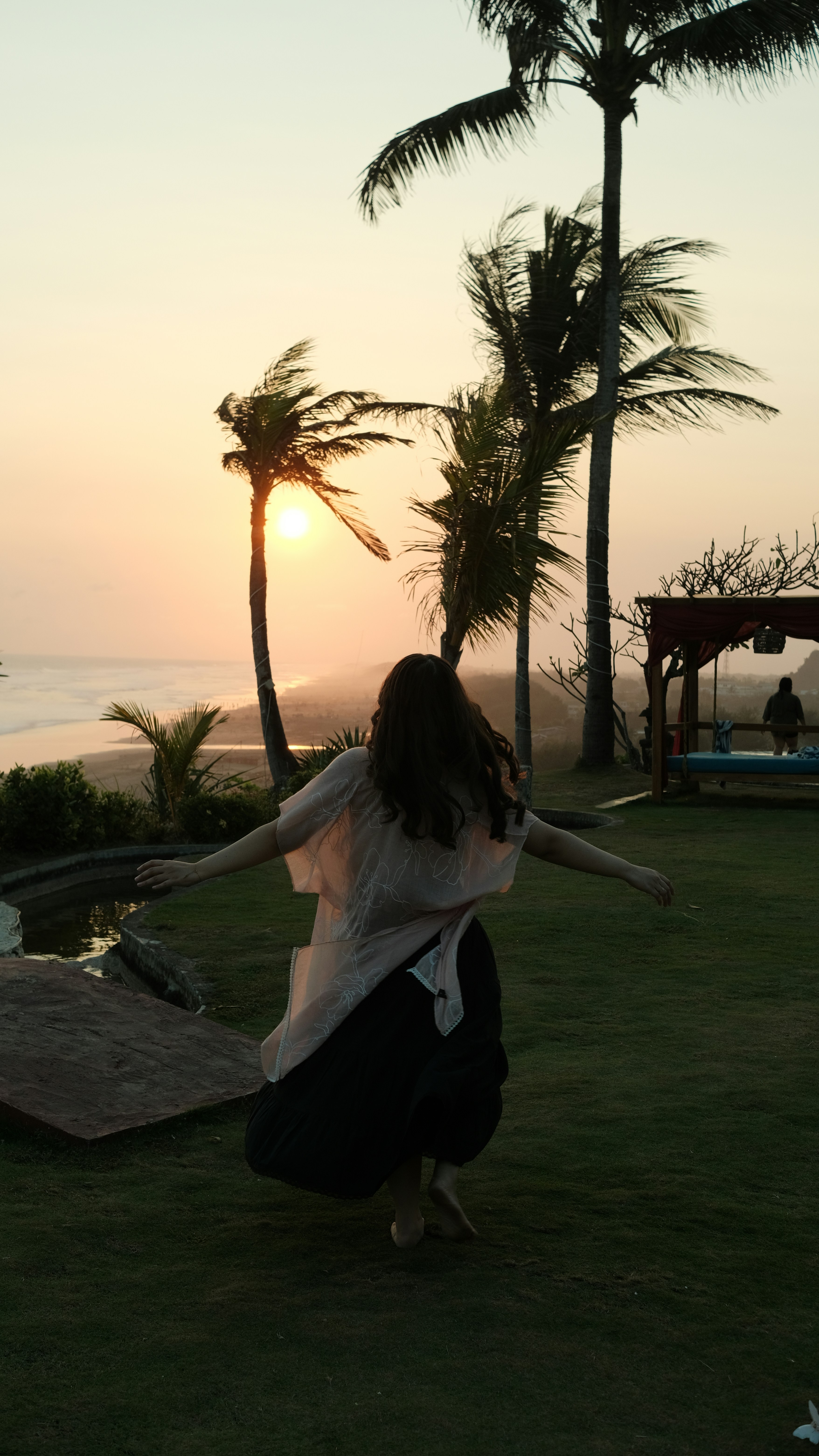 Sunlit Pose: A Silhouette by the Dusk-kissed Shore