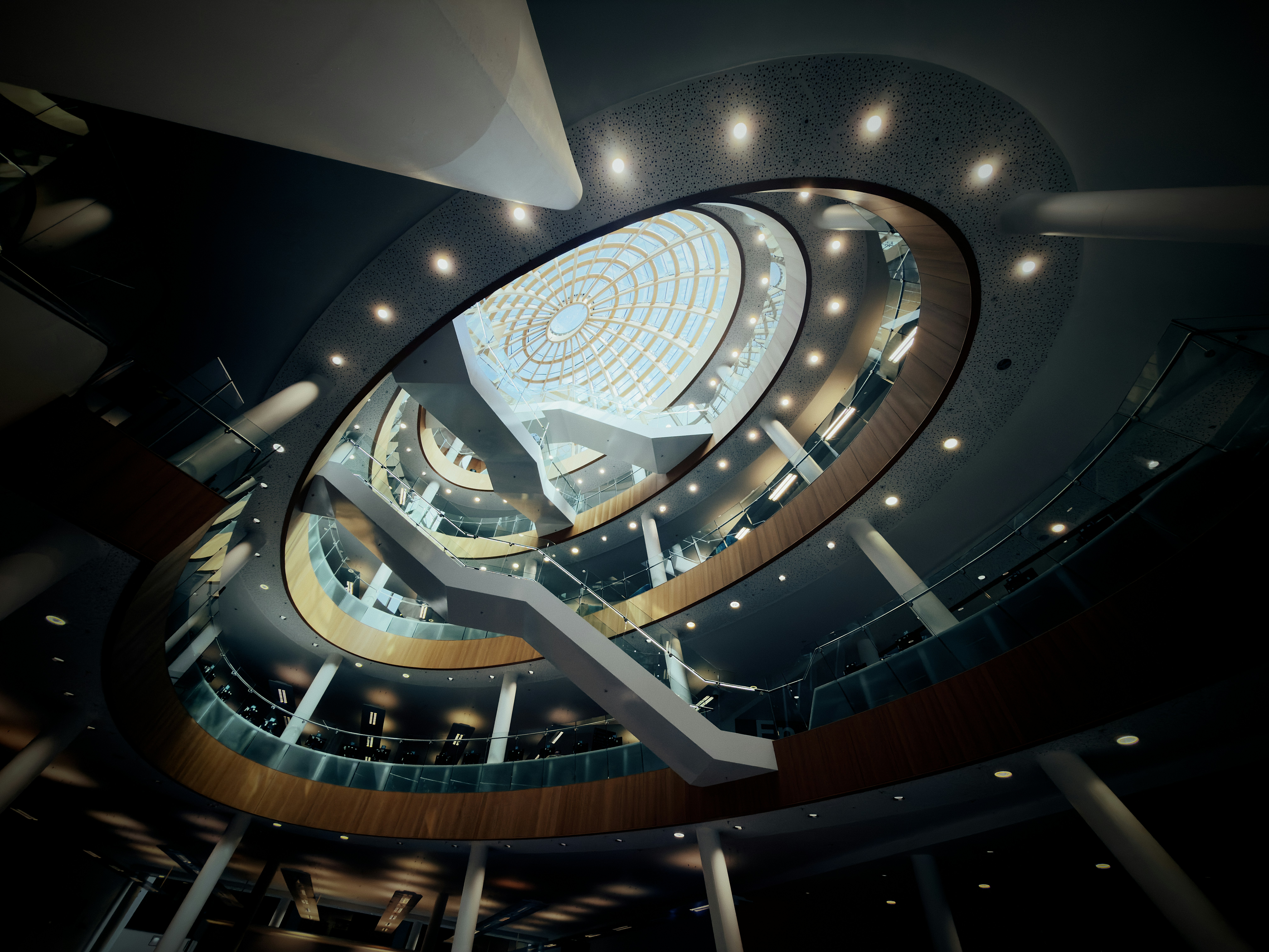 Spiral Atrium: Circular Walkways Weaving Through Light