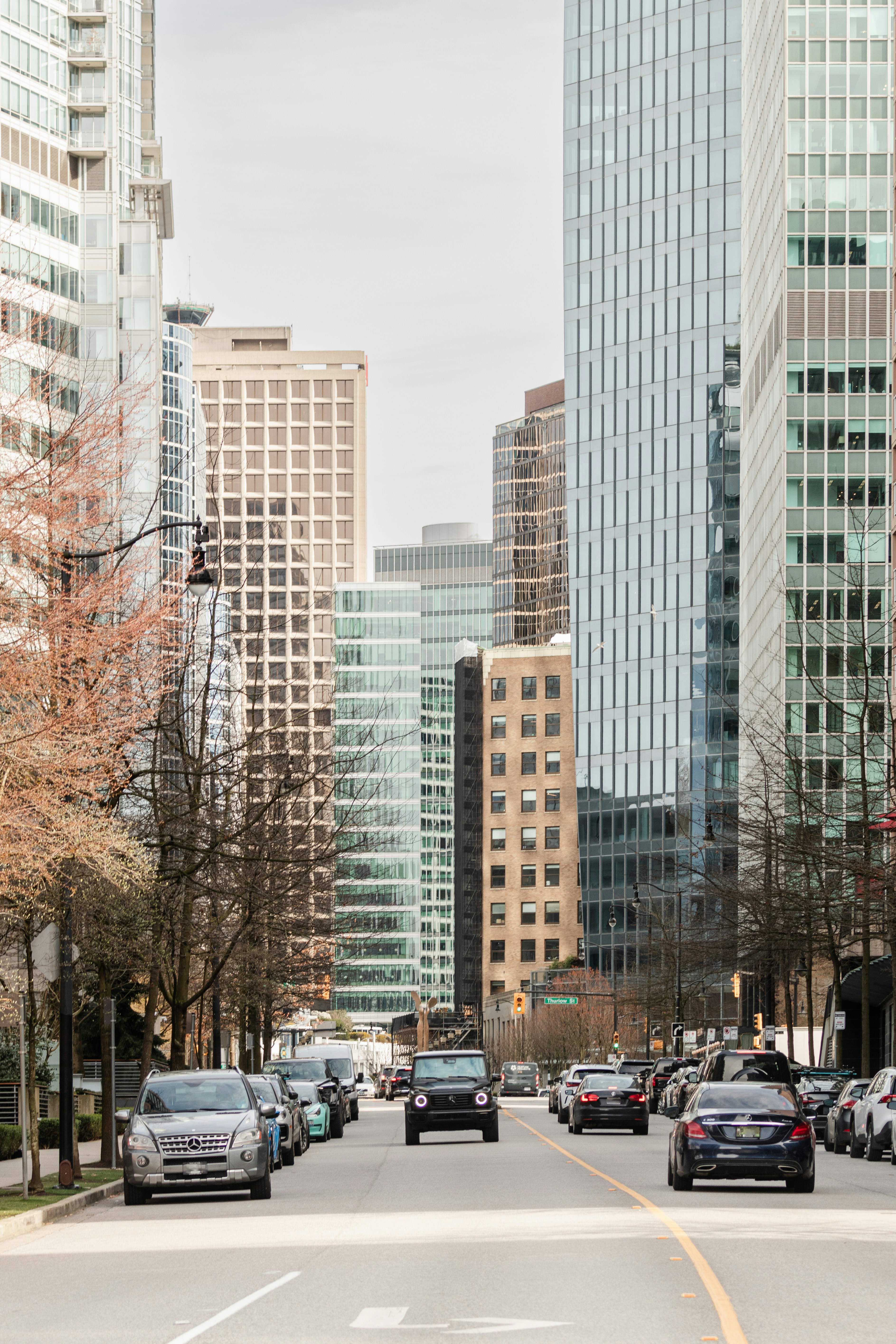 City Pulse: Cars Stream Through a Glass-Canopy Boulevard