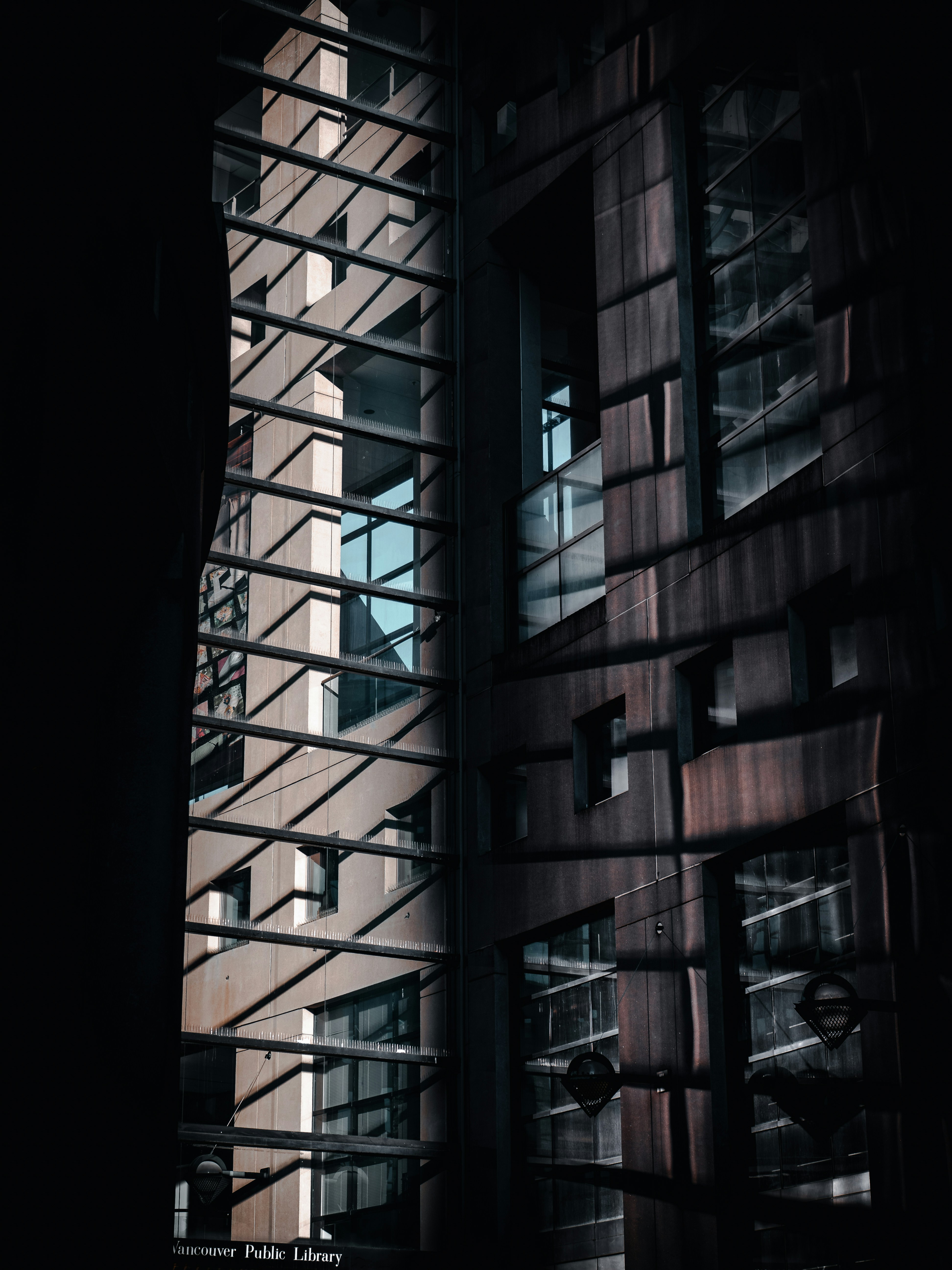 Intersecting Facades: Angular Light and Shadow on Modern Glass