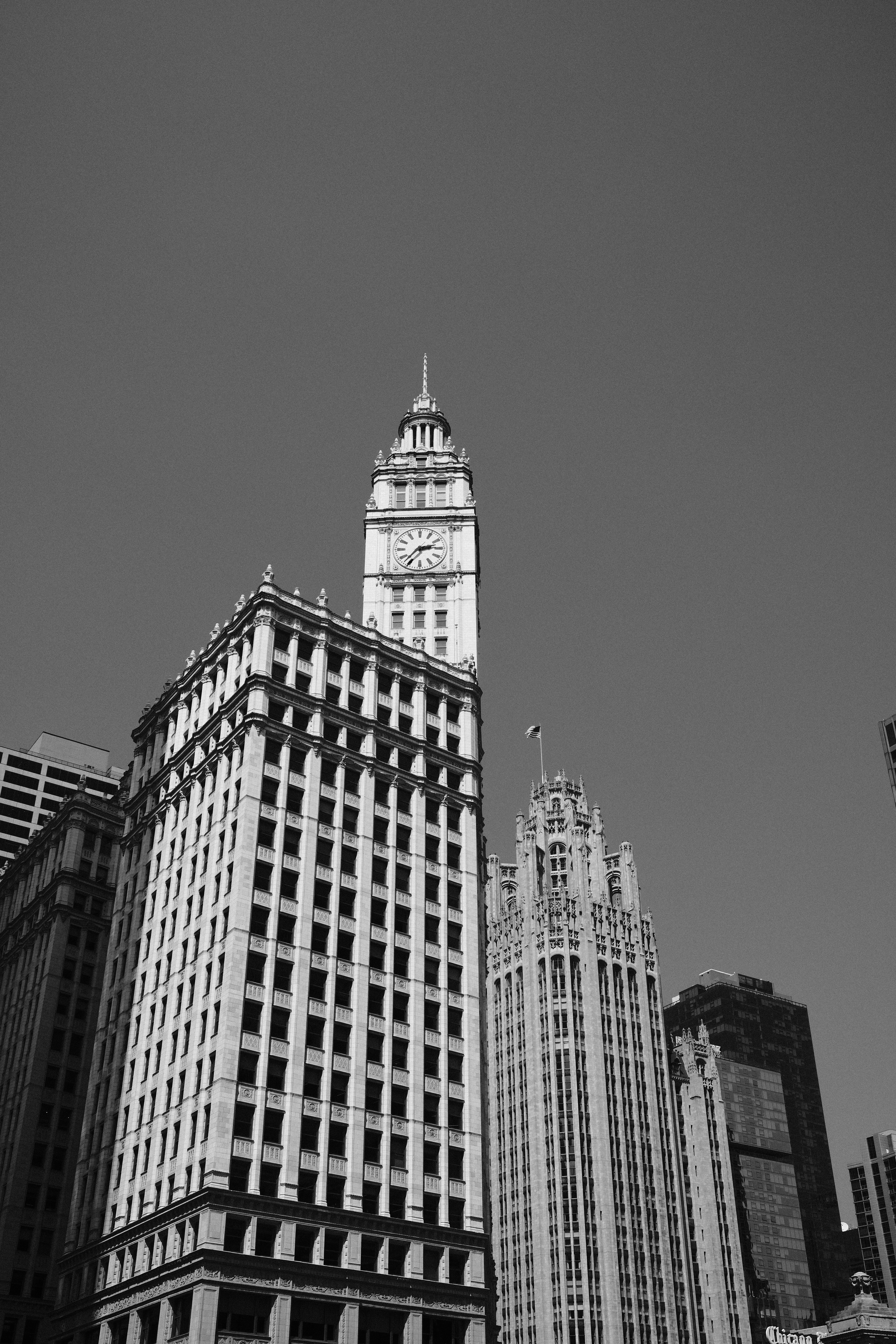 Clocktower Rising: A Black-and-White Cityscape of Tilted Grandeur