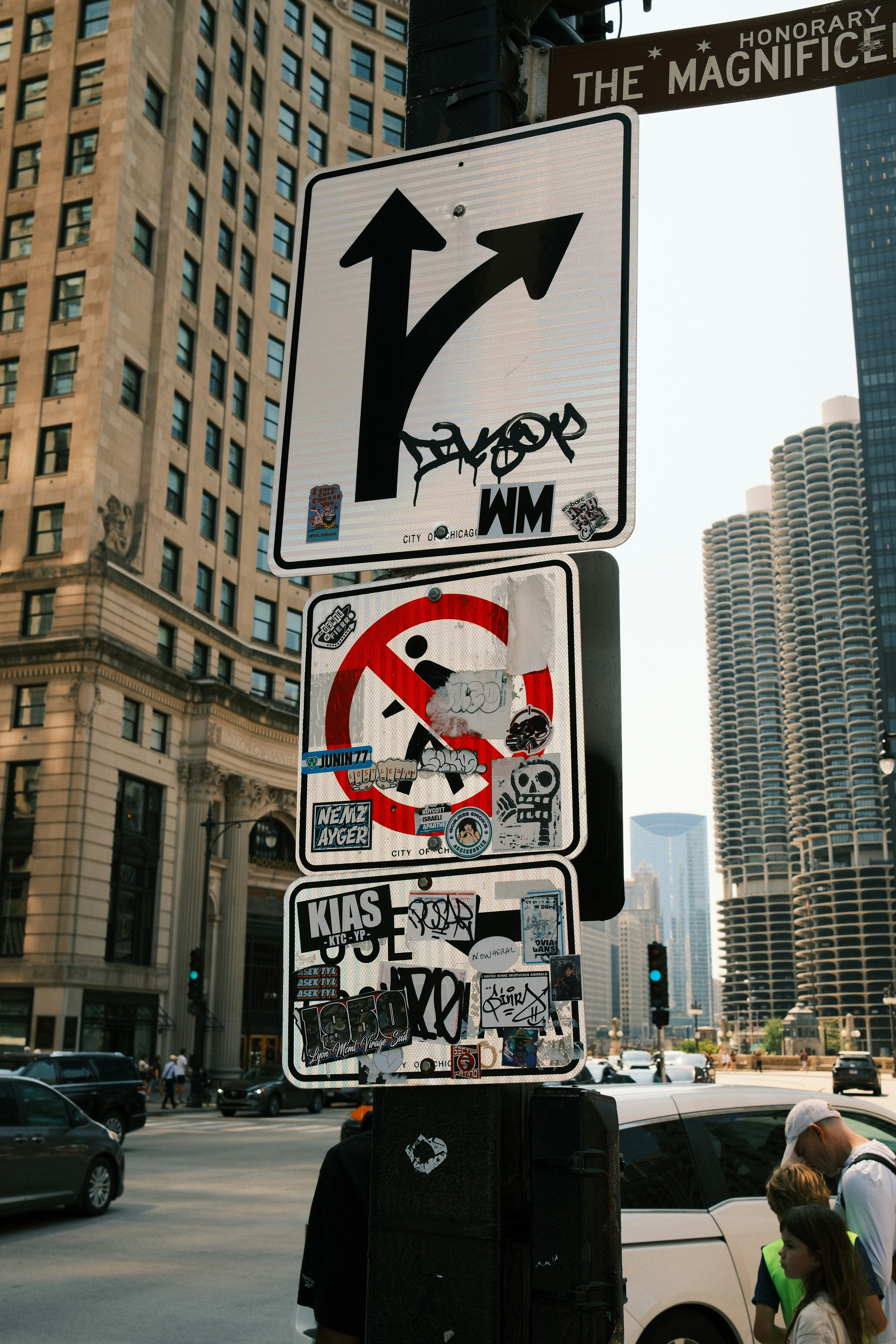 Urban Signage and Sticker Cascade at a Busy Street Corner