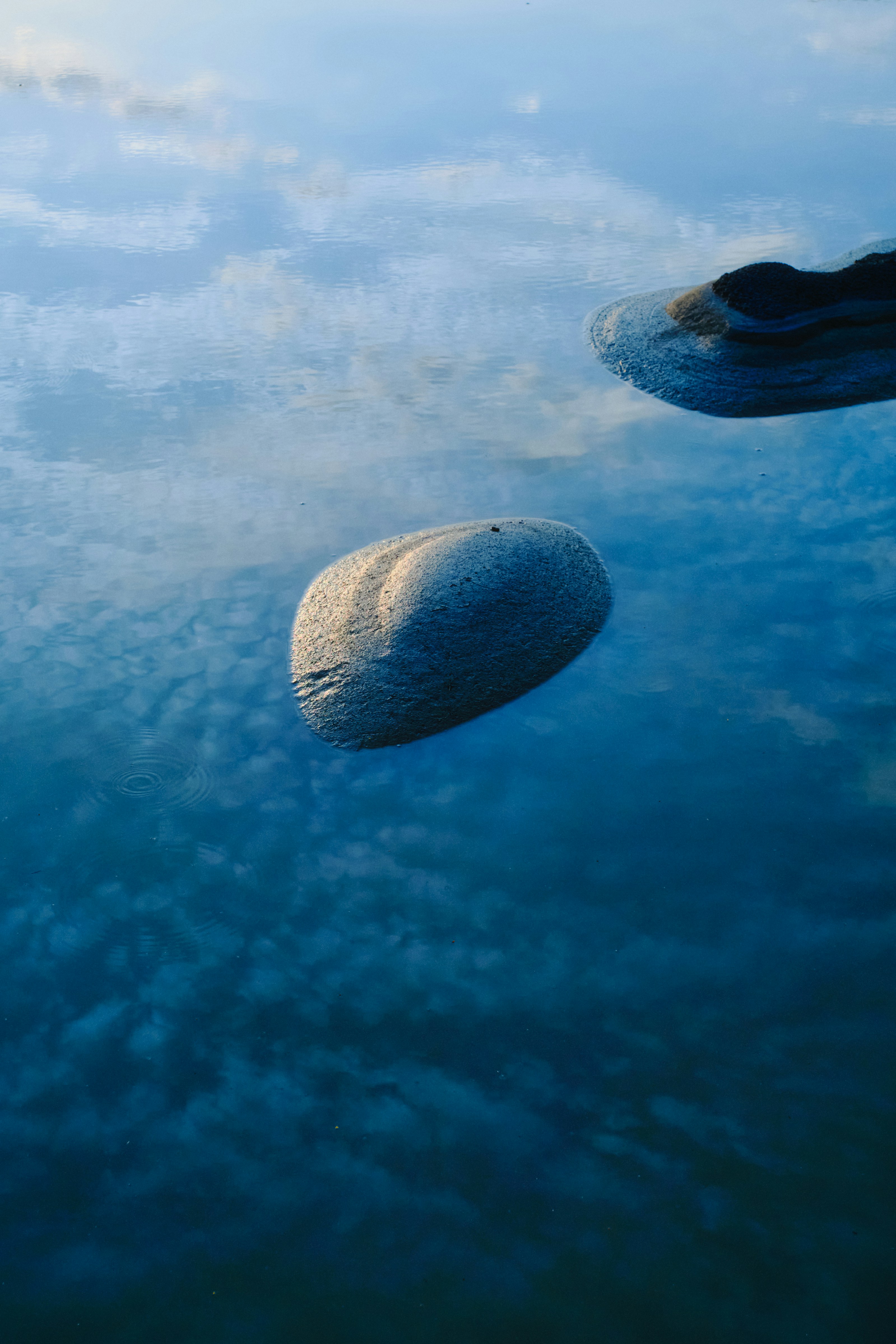 Pebble in a Quiet Blue Mirror