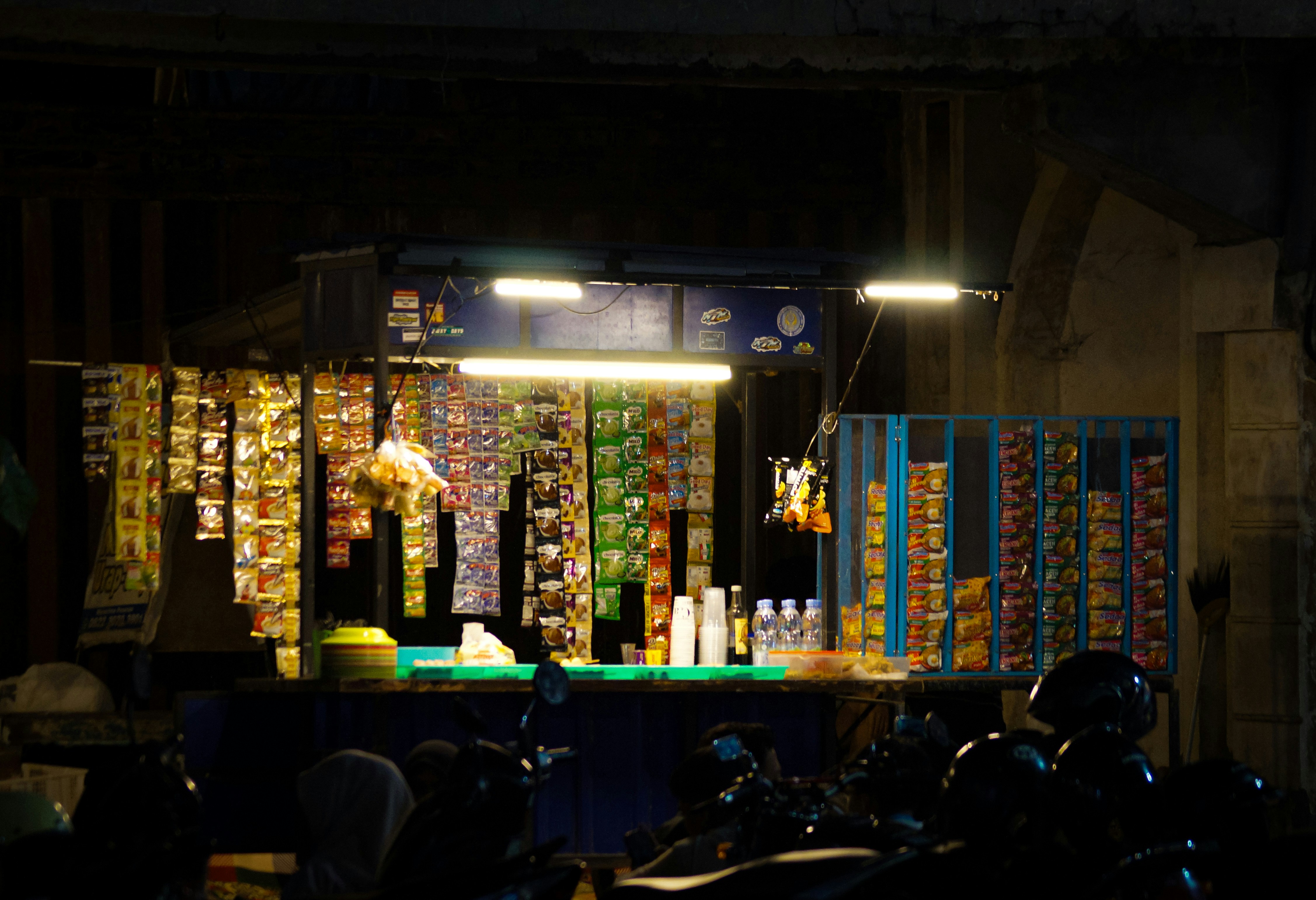 Neon Snack Stall Under Dim Underpass