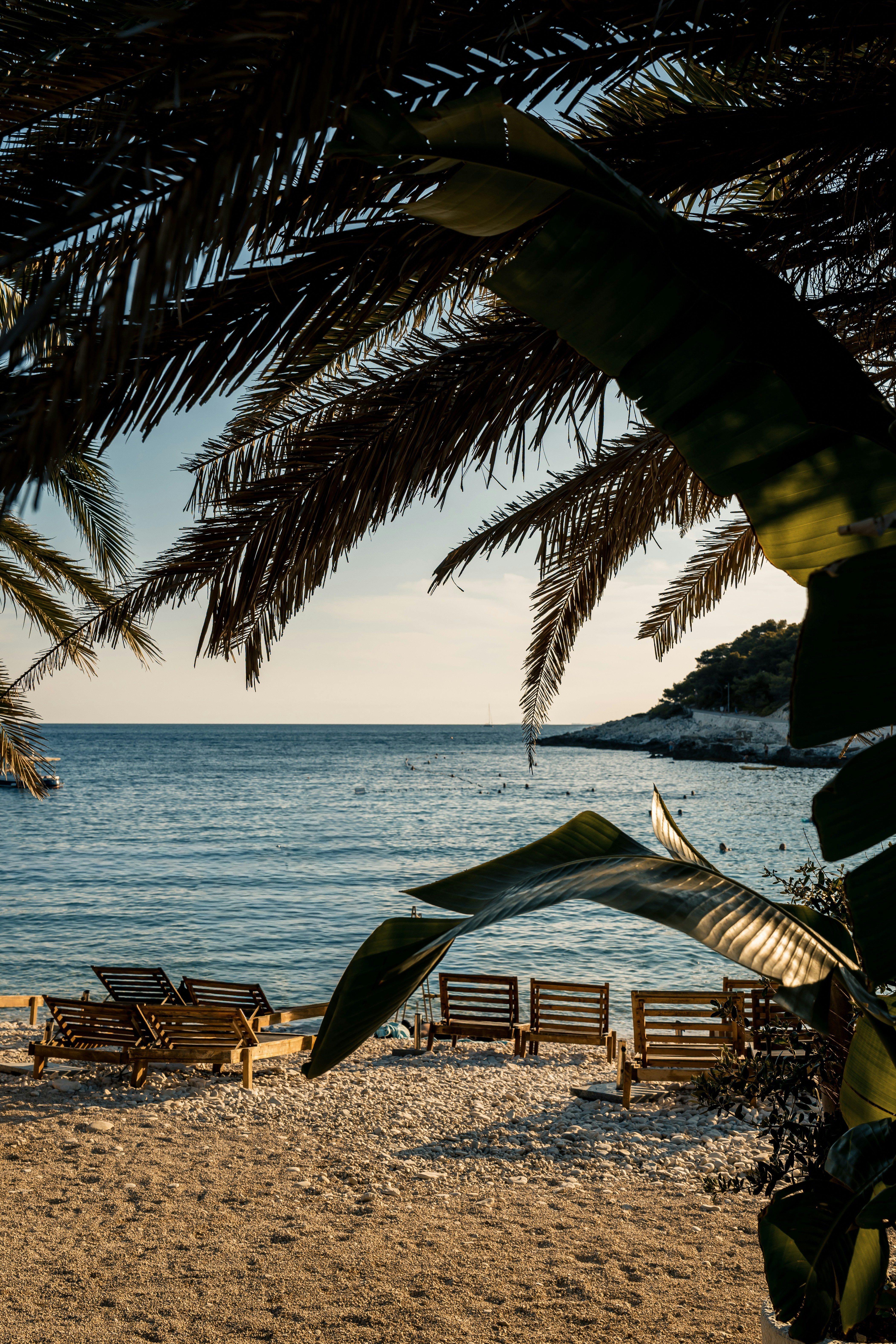 Sunlit Beach Chairs Framing a Quiet Sea