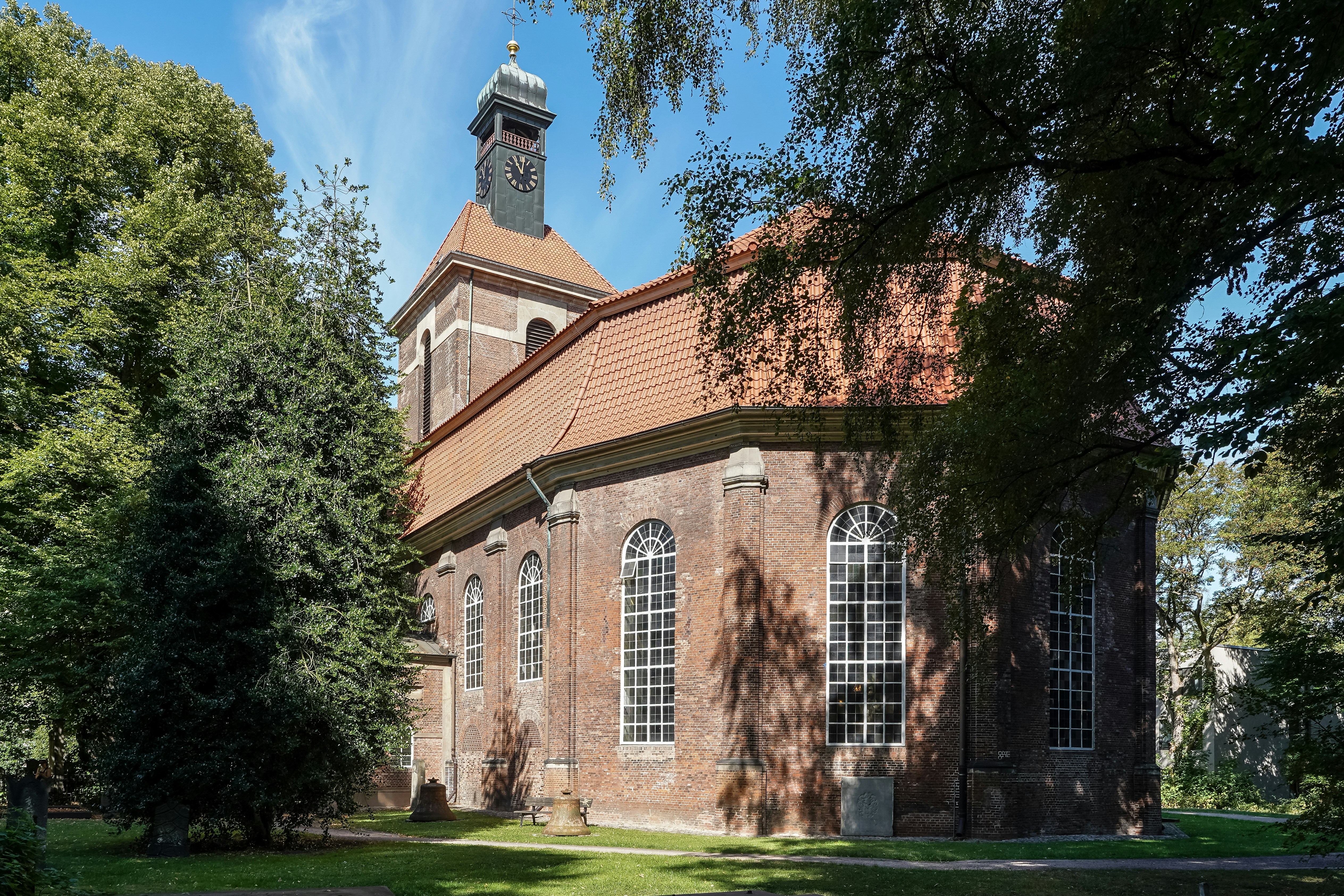 Brick Parish Hall with Clock Tower under a Streak of Dappled Sunlight