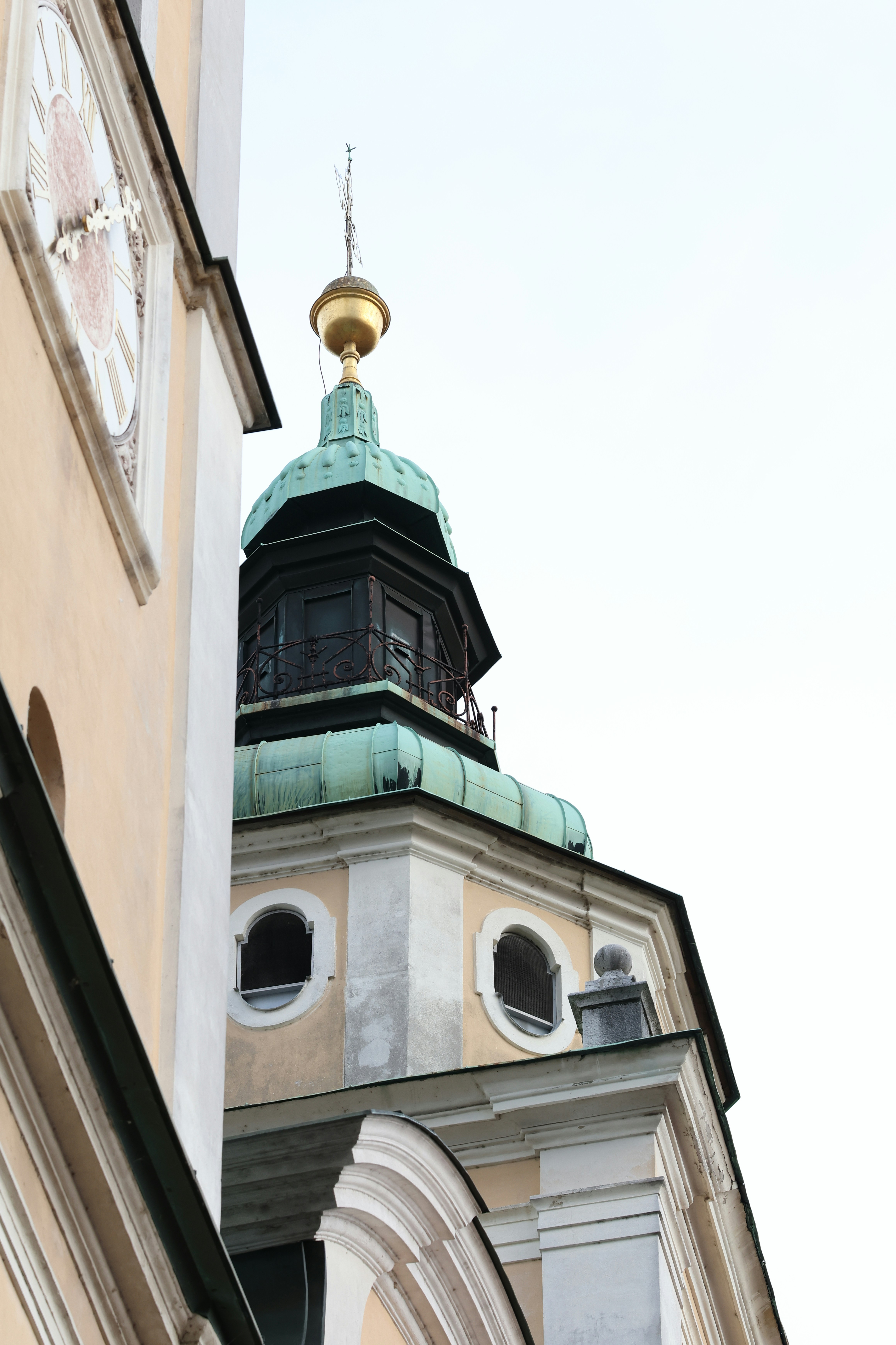 Copper-Topped Spire Rising Above Classical Facades