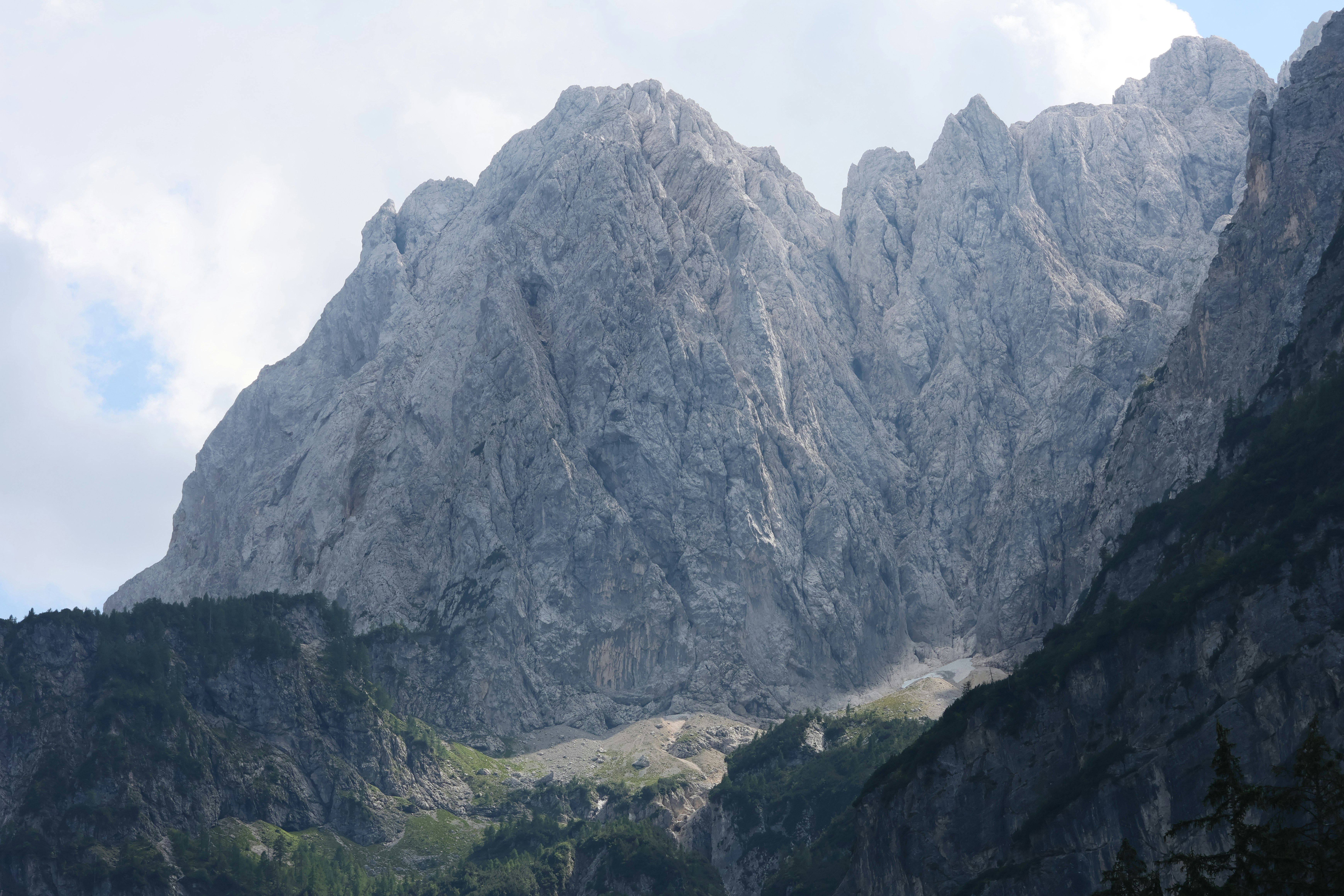 Towards the Peak: A Jagged Crown Looms Over Quiet Valley