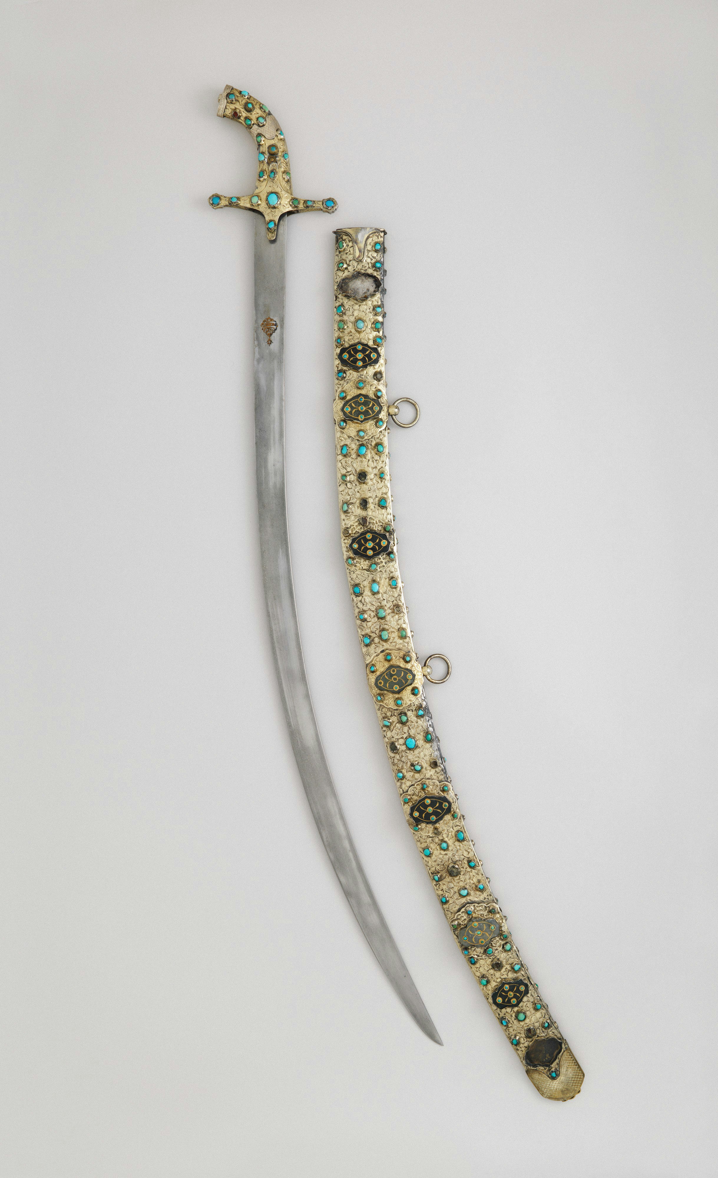 Title: Scimitar with Scabbard,Date: late 16th–17th century,Culture: Hilt and scabbard, Turkish; Blade, Iranian,Medium: Steel, copper alloy (brass), silver, wood, gold, jade, turquoise, copper,Dimensions: H. with scabbard 42 1/16 in. (106.8 cm); H. without scabbard 40 1/8 in. (101.9 cm); H. of blade 35 in. (88.9 cm); Wt. 4 lb. 4 oz. (1928 g); Wt. of scabbard 2 lb. (906 g),Classification: Swords,Credit Line: Rogers Fund and Pfeiffer Fund, 1978,Object Number: 1978.145a, b,Curatorial Department: Arms and Armor. http://www.metmuseum.org/art/collection/search/24876