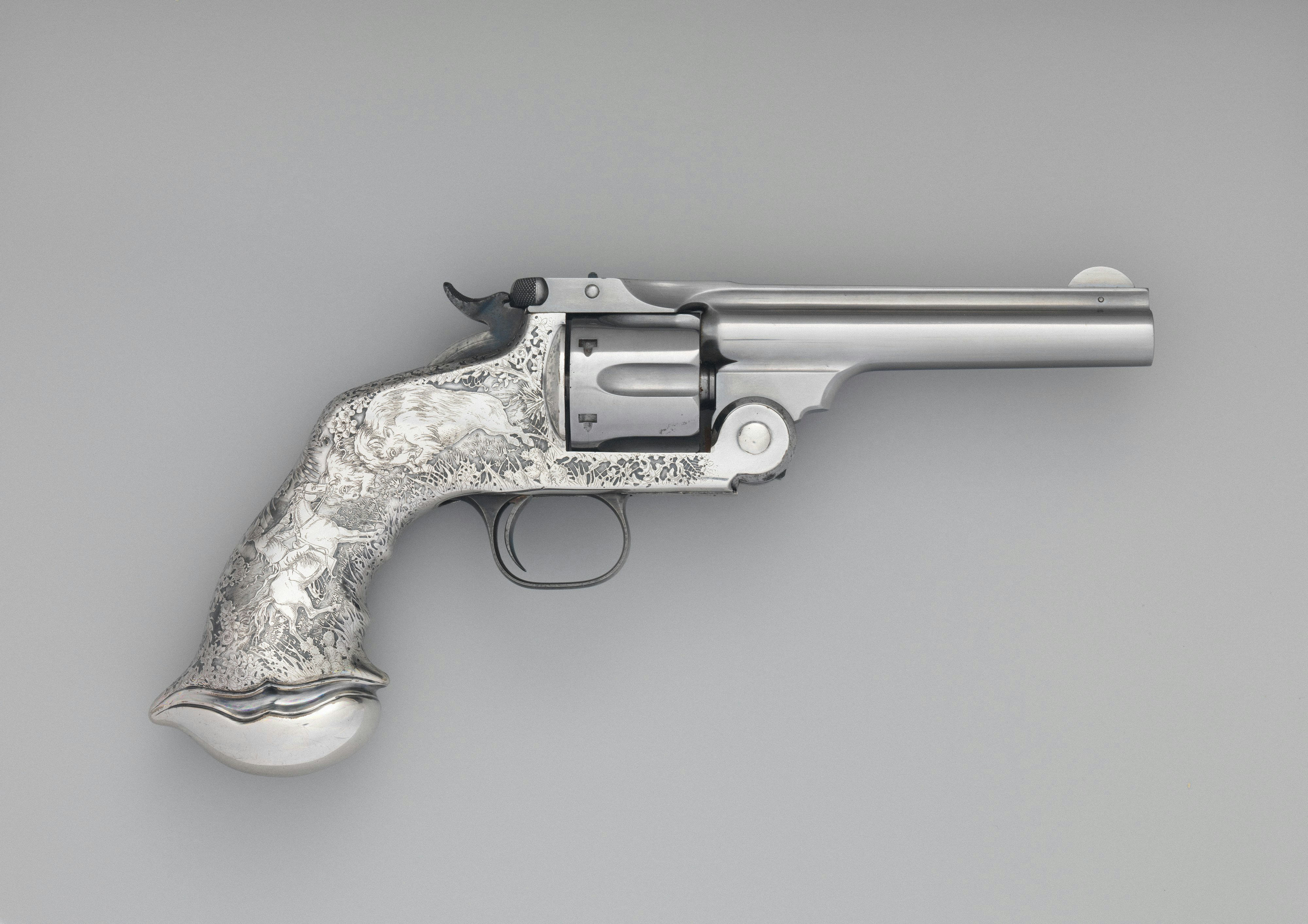 Title: Smith and Wesson .44 New Model No. 3 Single-Action Revolver, serial no. 25120,Manufacturer: Smith & Wesson (American, established 1852),Decorator: Tiffany & Co. (American, established 1837),Date: ca. 1888,Geography: Springfield, Massachusetts; New York, New York,Culture: American, Springfield, Massachusetts and New York,Medium: Steel, silver, nickel,Classification: Firearms-Pistols-Revolvers,Credit Line: Gift of Gerald Klaz, M.D., Trustee - The Gerald Klaz Trust, 2007,Object Number: 2007.477,Curatorial Department: Arms and Armor. http://www.metmuseum.org/art/collection/search/24973