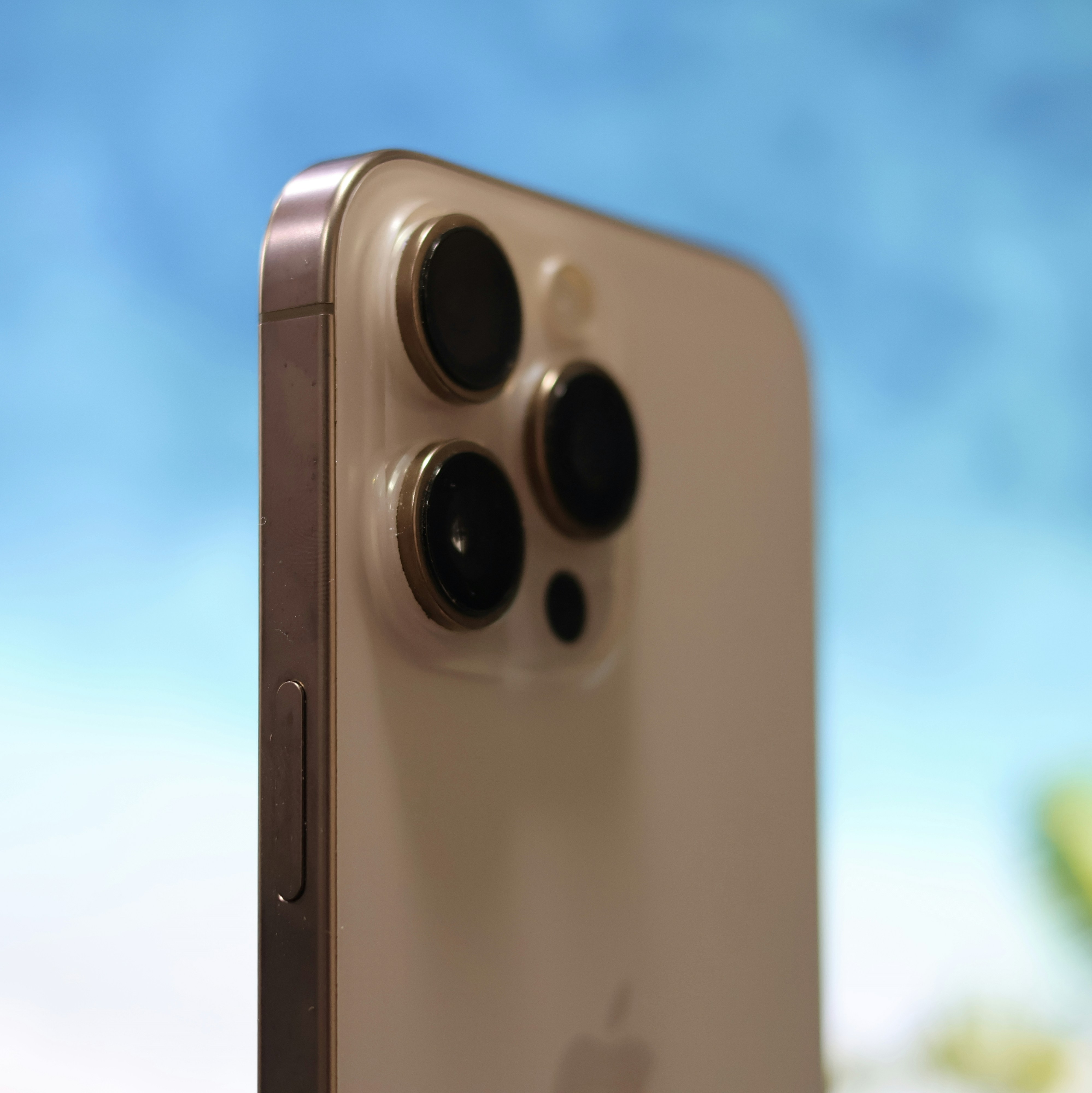 Close-up of a Protruding Triple-Camera Array on a Metallic iPhone
