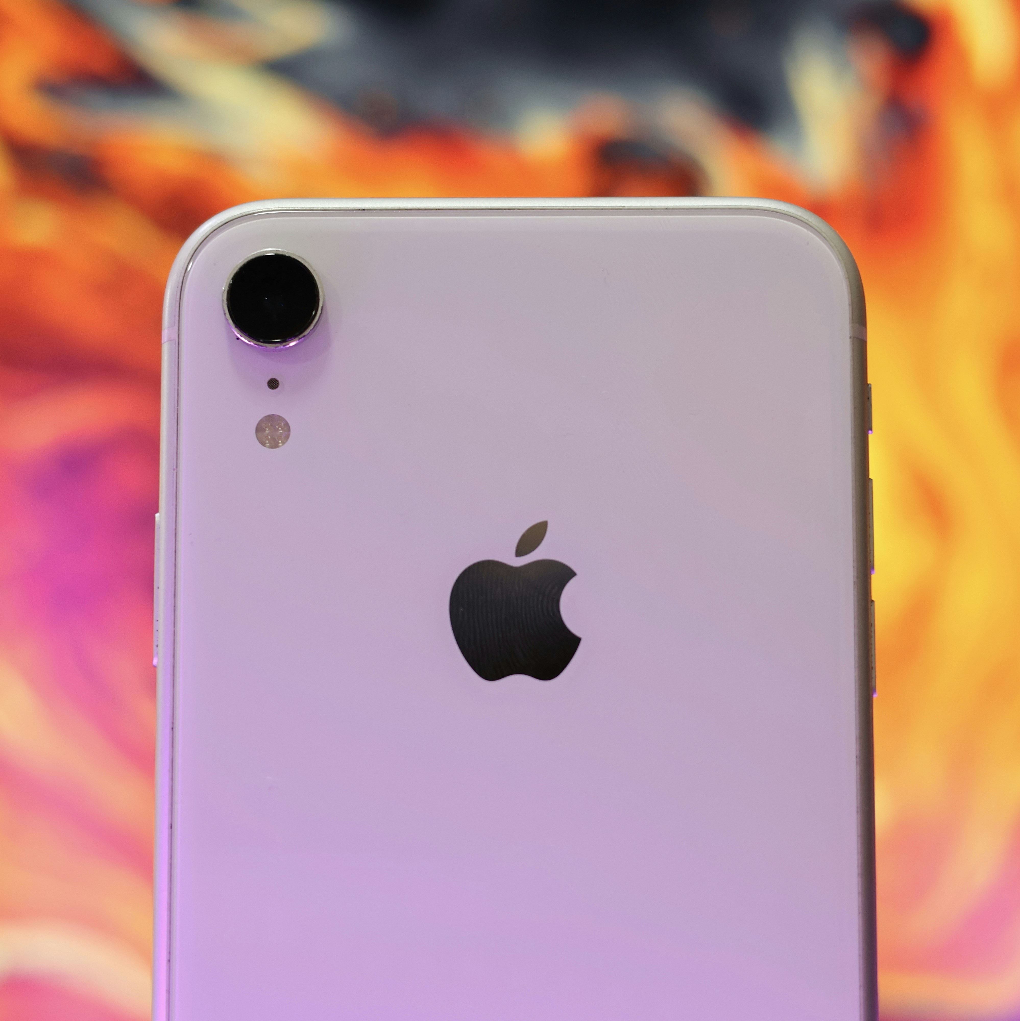 Lilac Glow: The iPhone Back Shrouded in Color and Iconic Silhouette