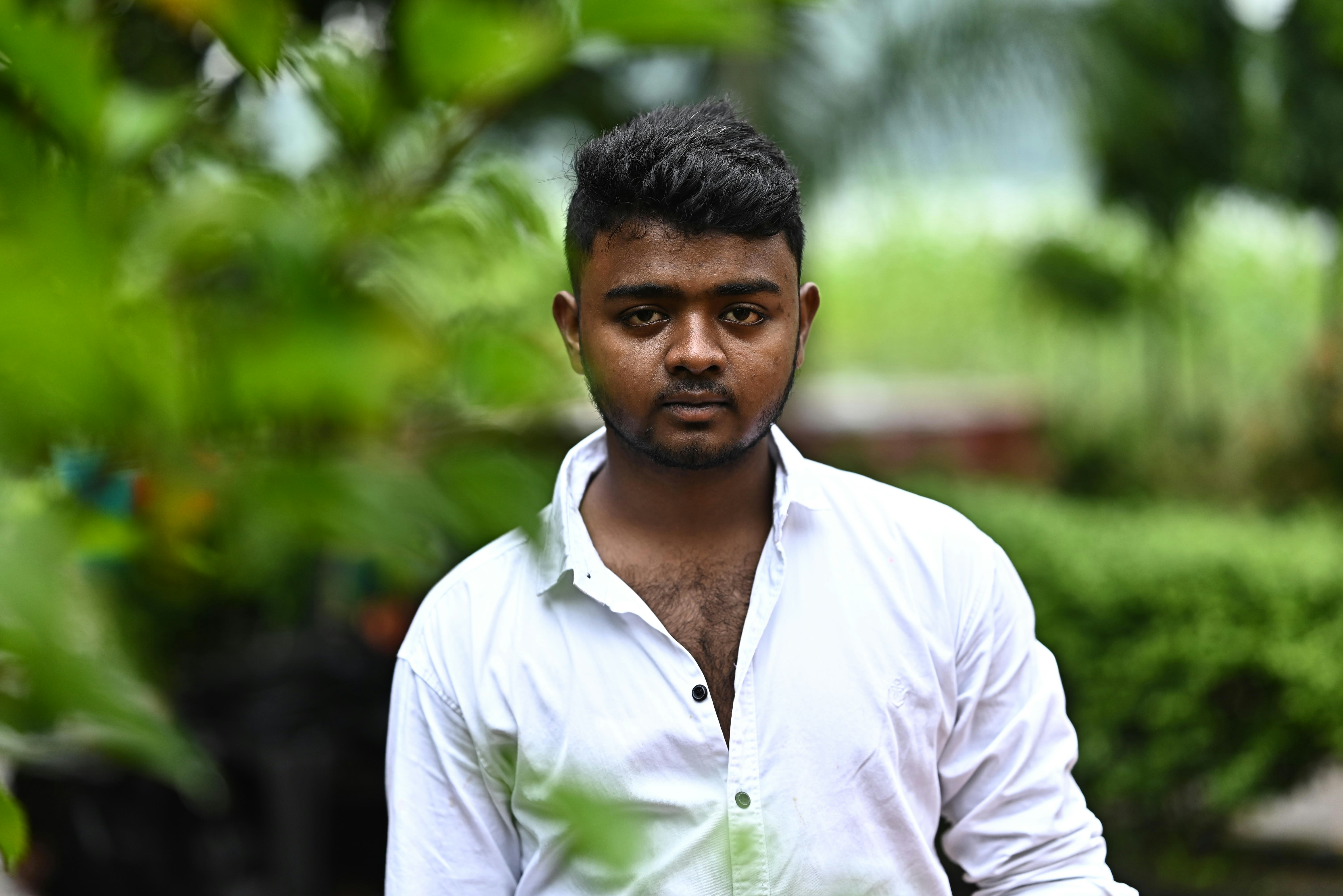 Portrait in Soft Focus: A Quiet Presence Beneath Green Canopy