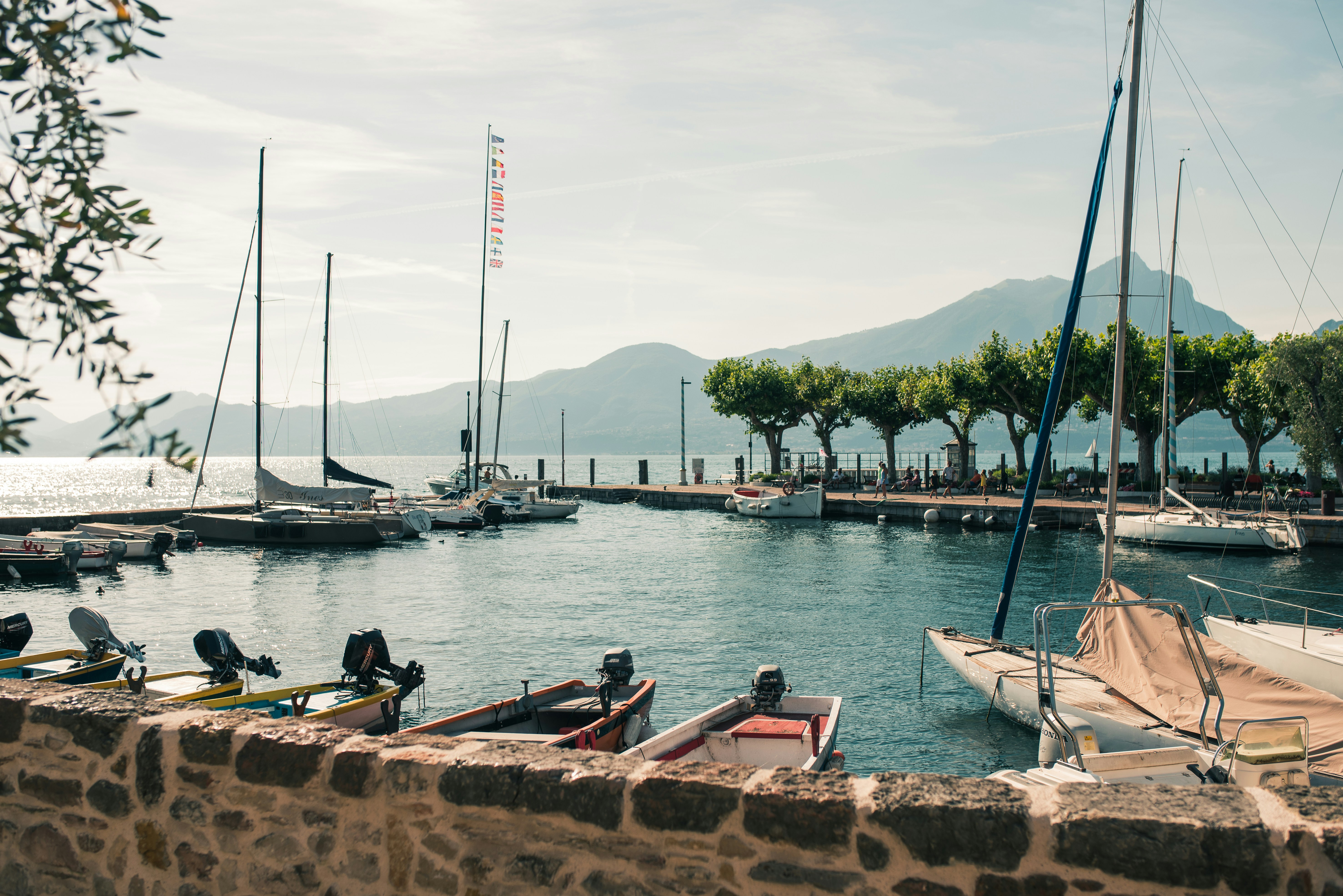 Quiet Harbor Vista: Boats Rest Along a Stone-Jawed Embankment