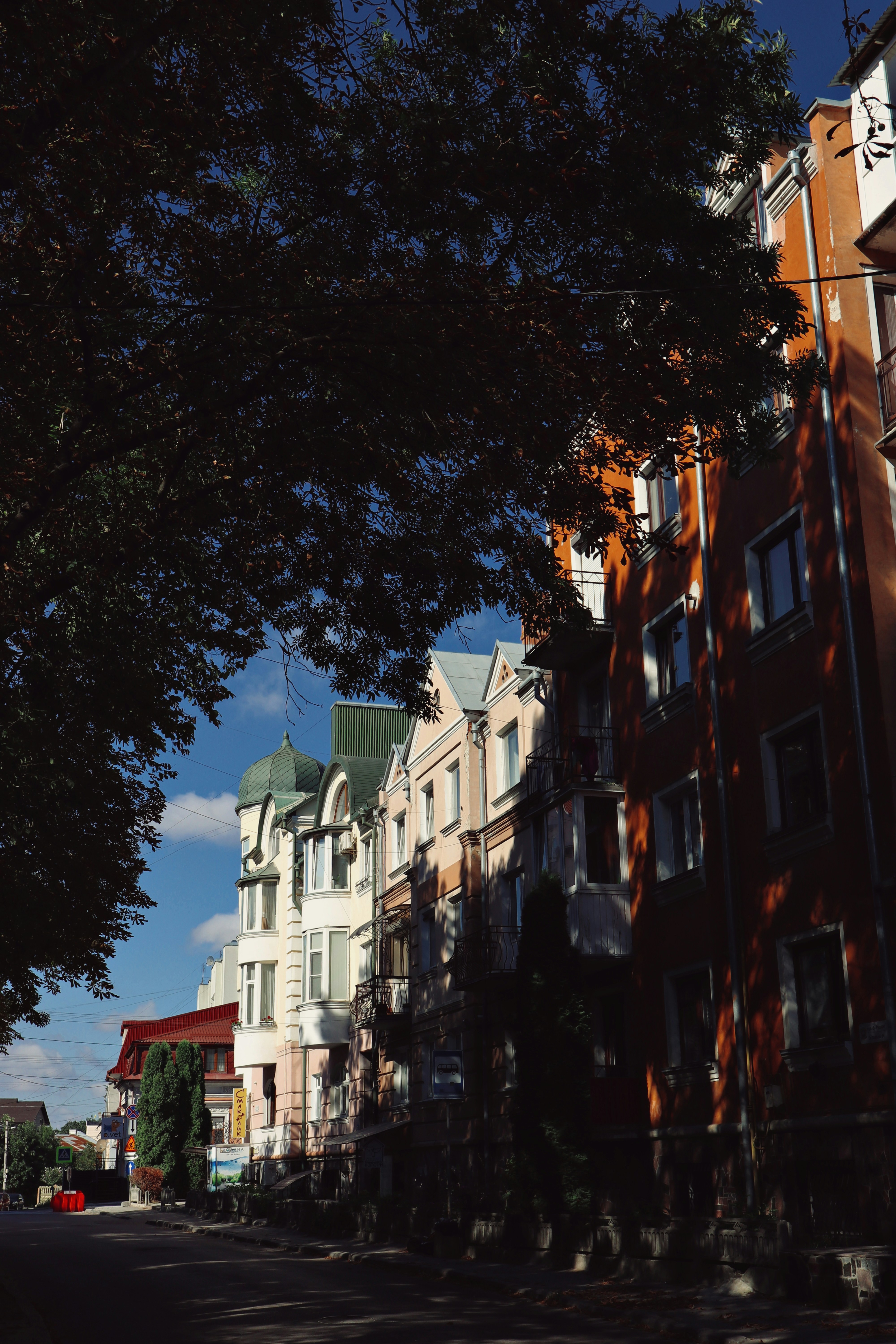 Sunlit Street Facades Pierced by Shade