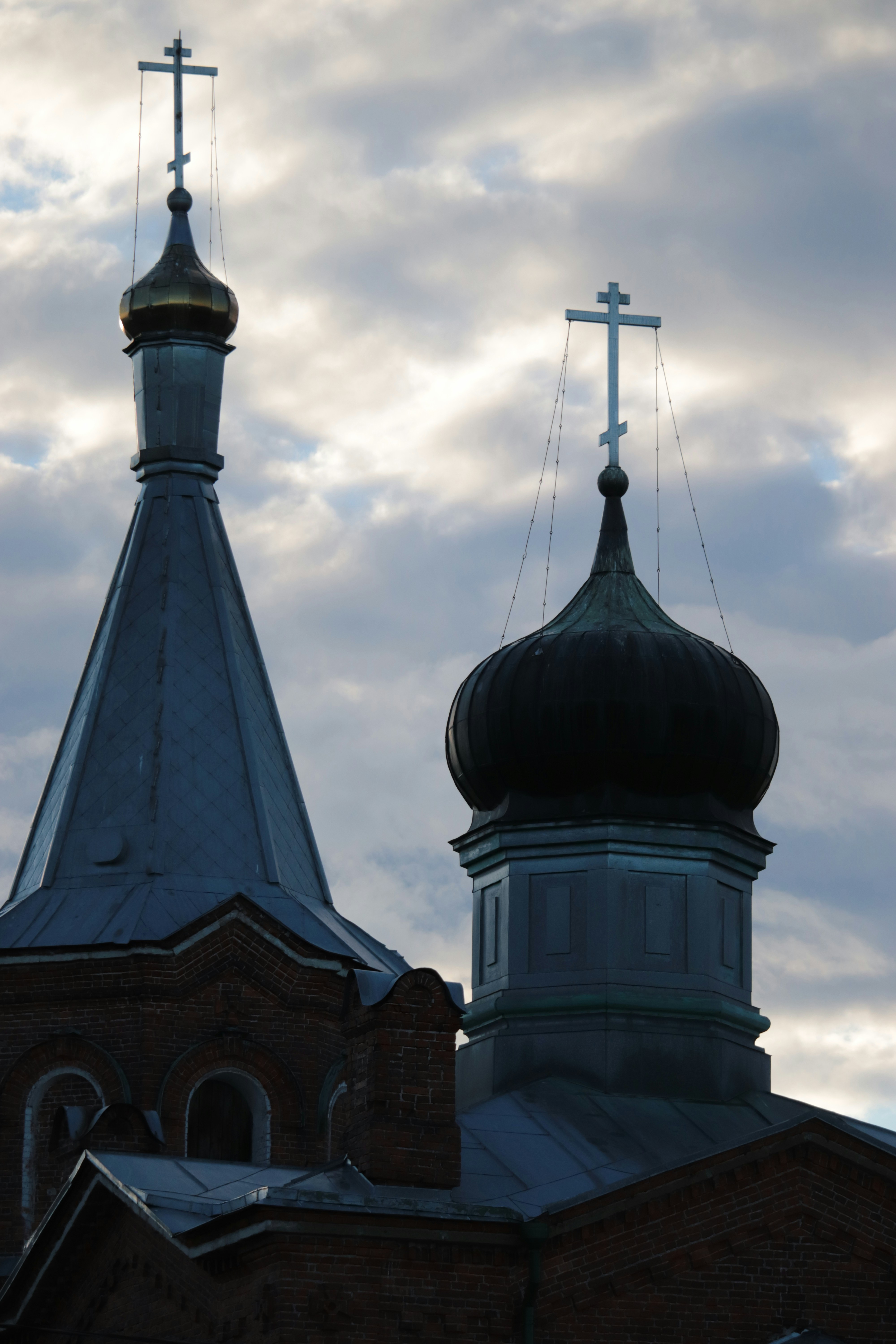 Domed Crosses Rising Above Brickwork: A Silent Spire Portrait