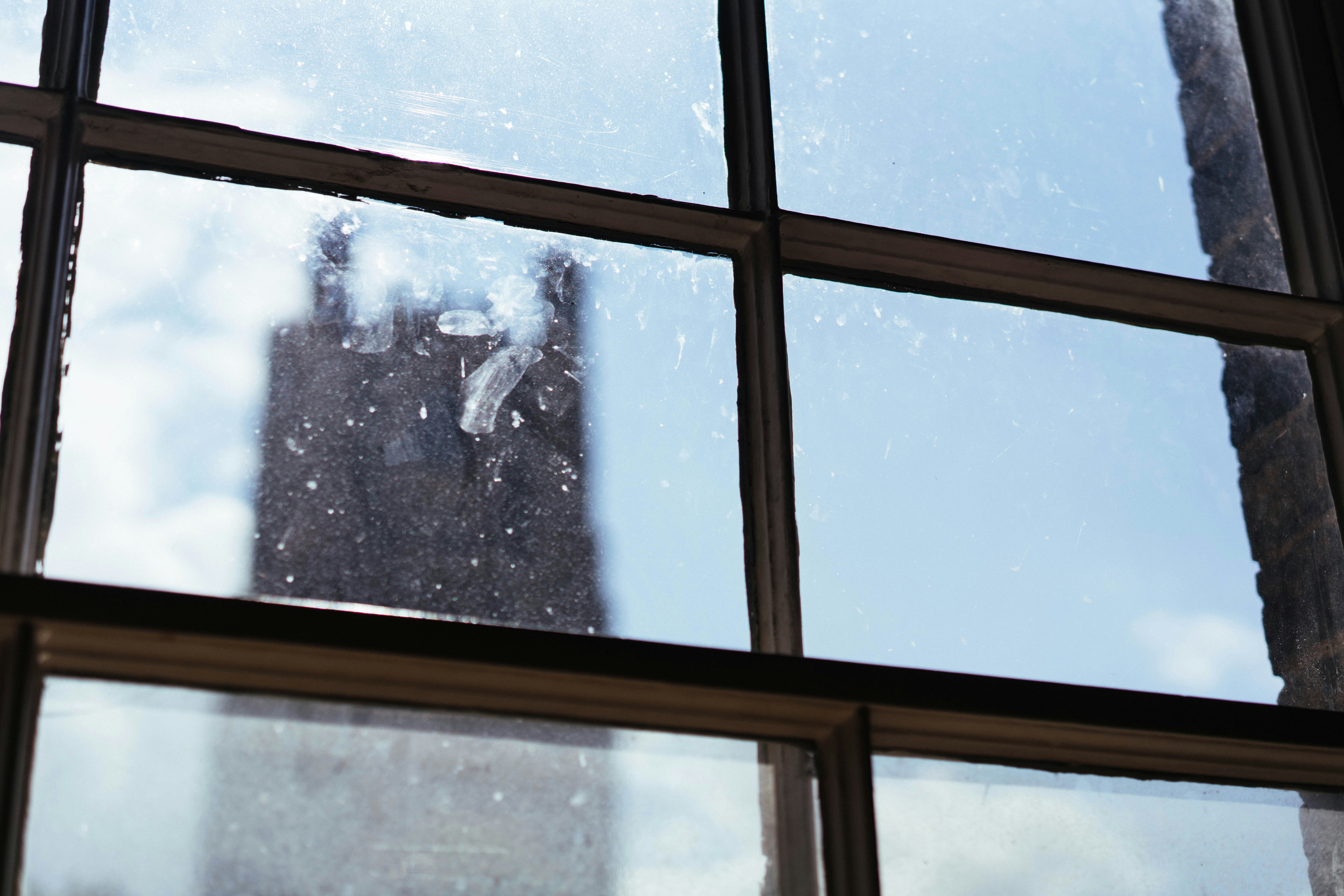 Framed Sky: A Glimpse Through Industrial Grids