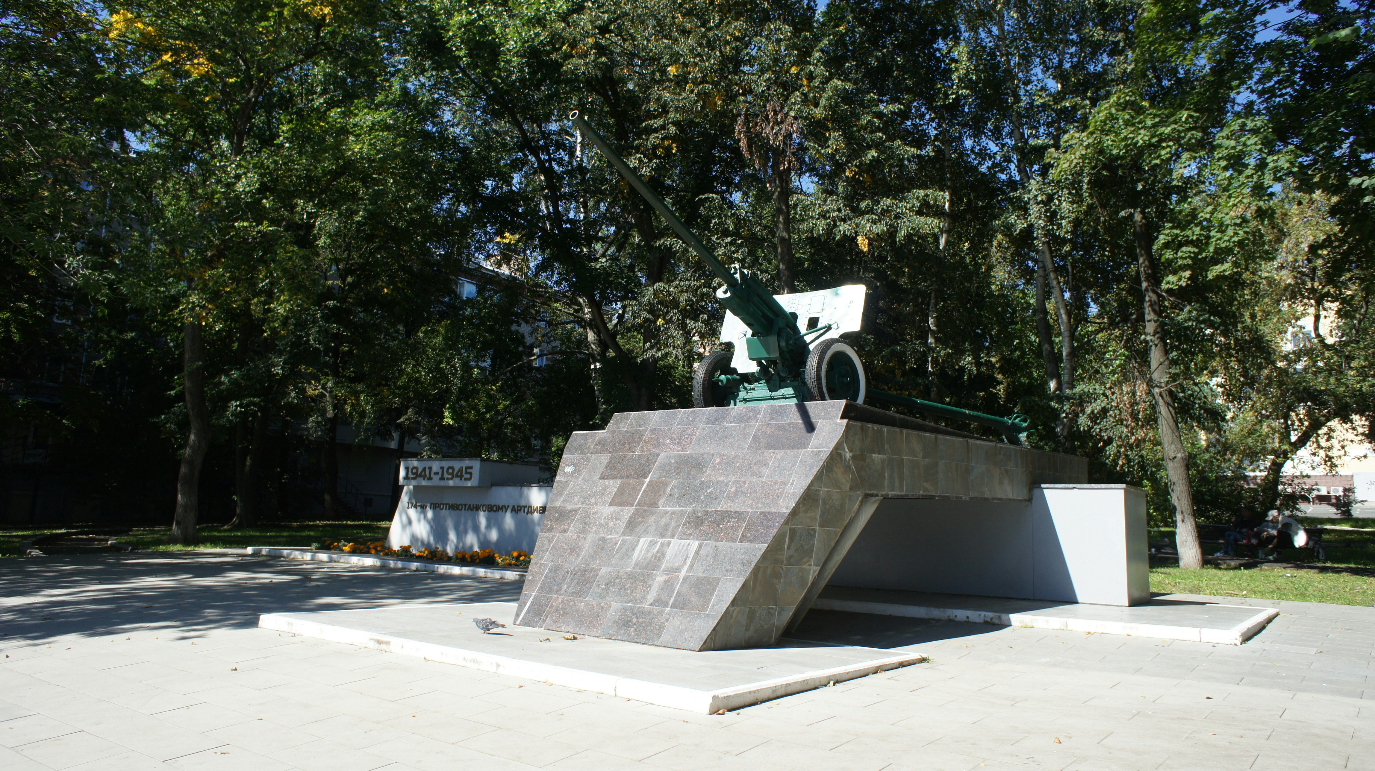 Angular Monument: A Geometric Tribute with Cannons and Slanted Peak