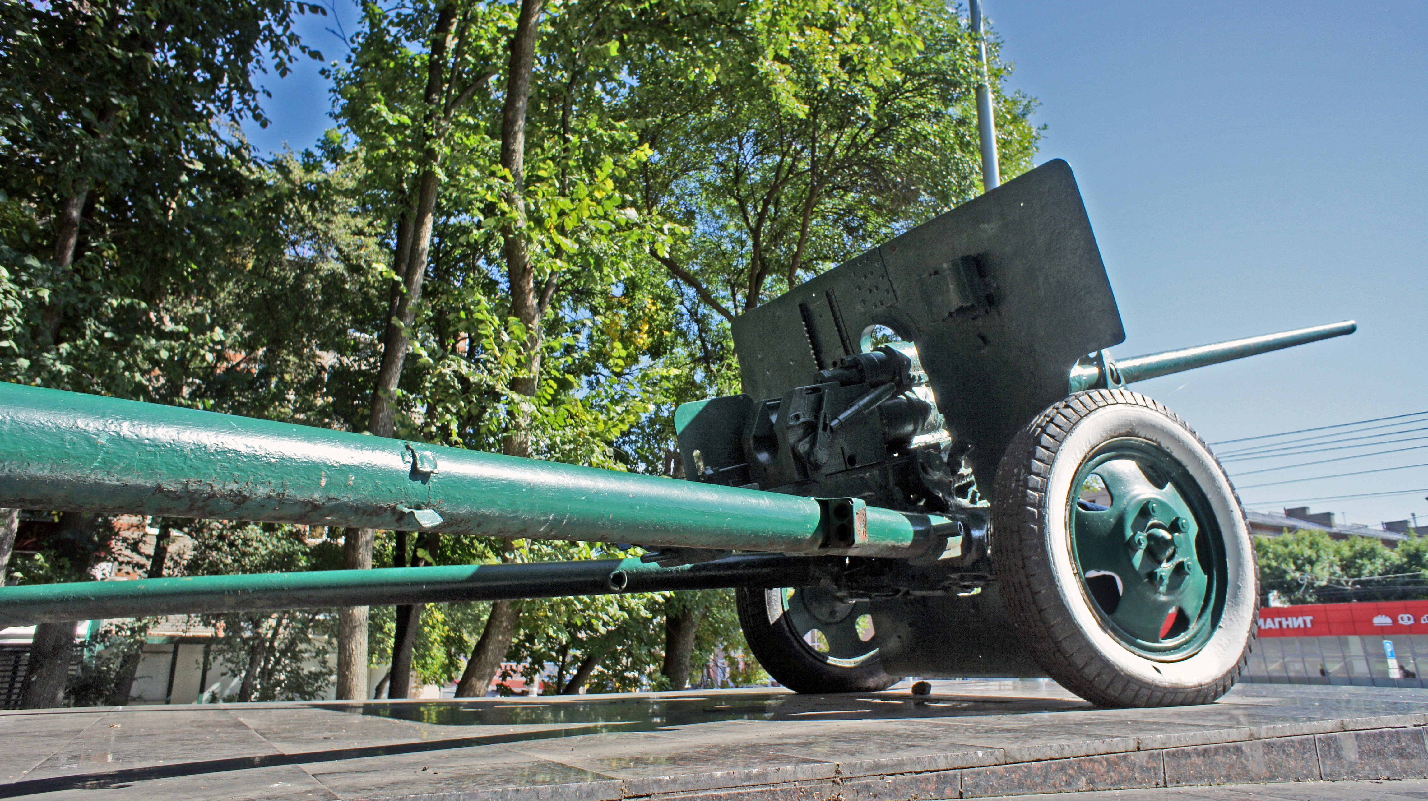 Cannon on a Tilt: A Vintage Gun Resting Above the Boardwalk