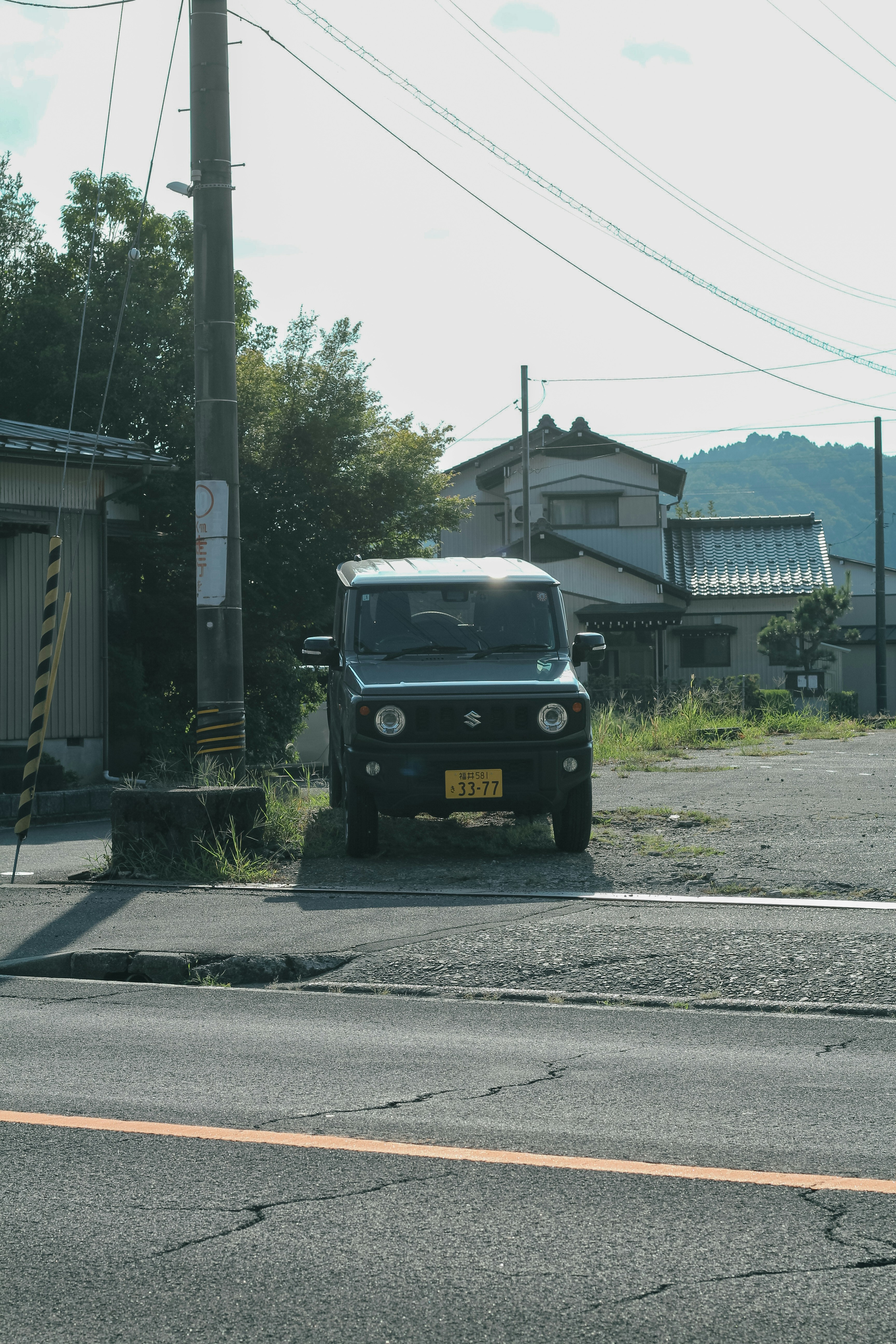 Sedan on the Quiet Street: A Car Framed by Suburban Stillness