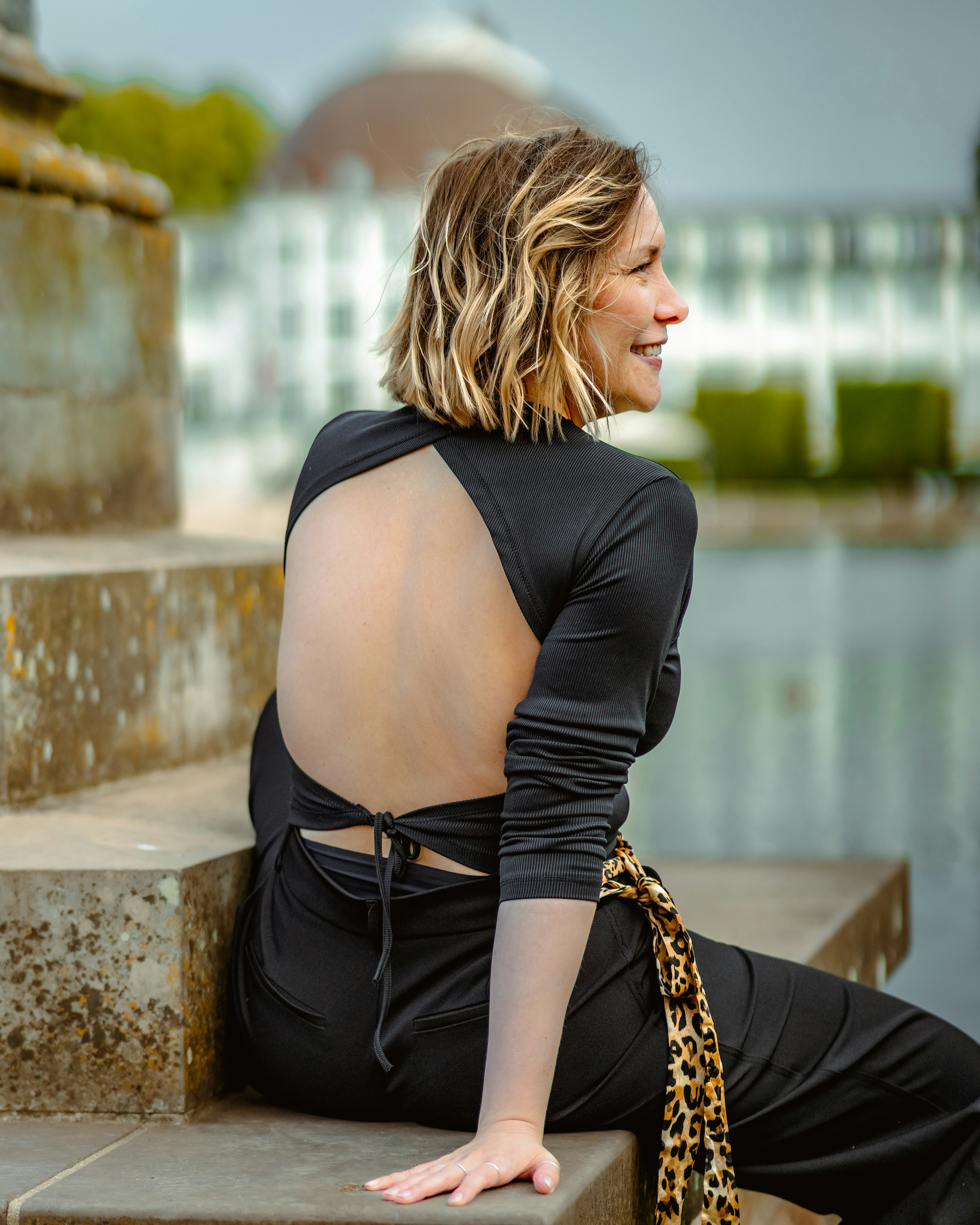 Backlit Confidence: A Sunlit Moment by the Riverside Steps