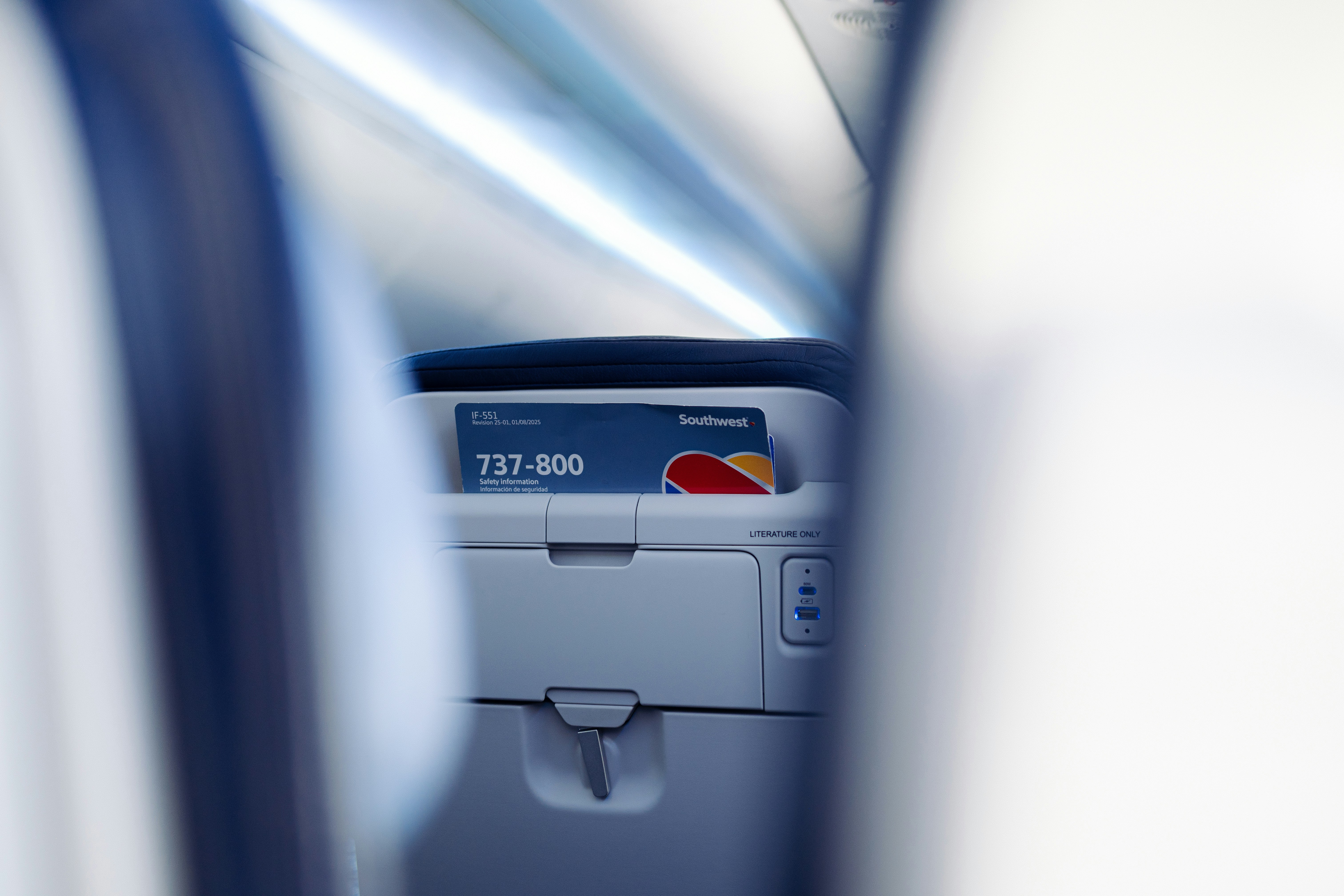 Winged Sunlight Overhead: A Quiet Airline Cabin Card Reader