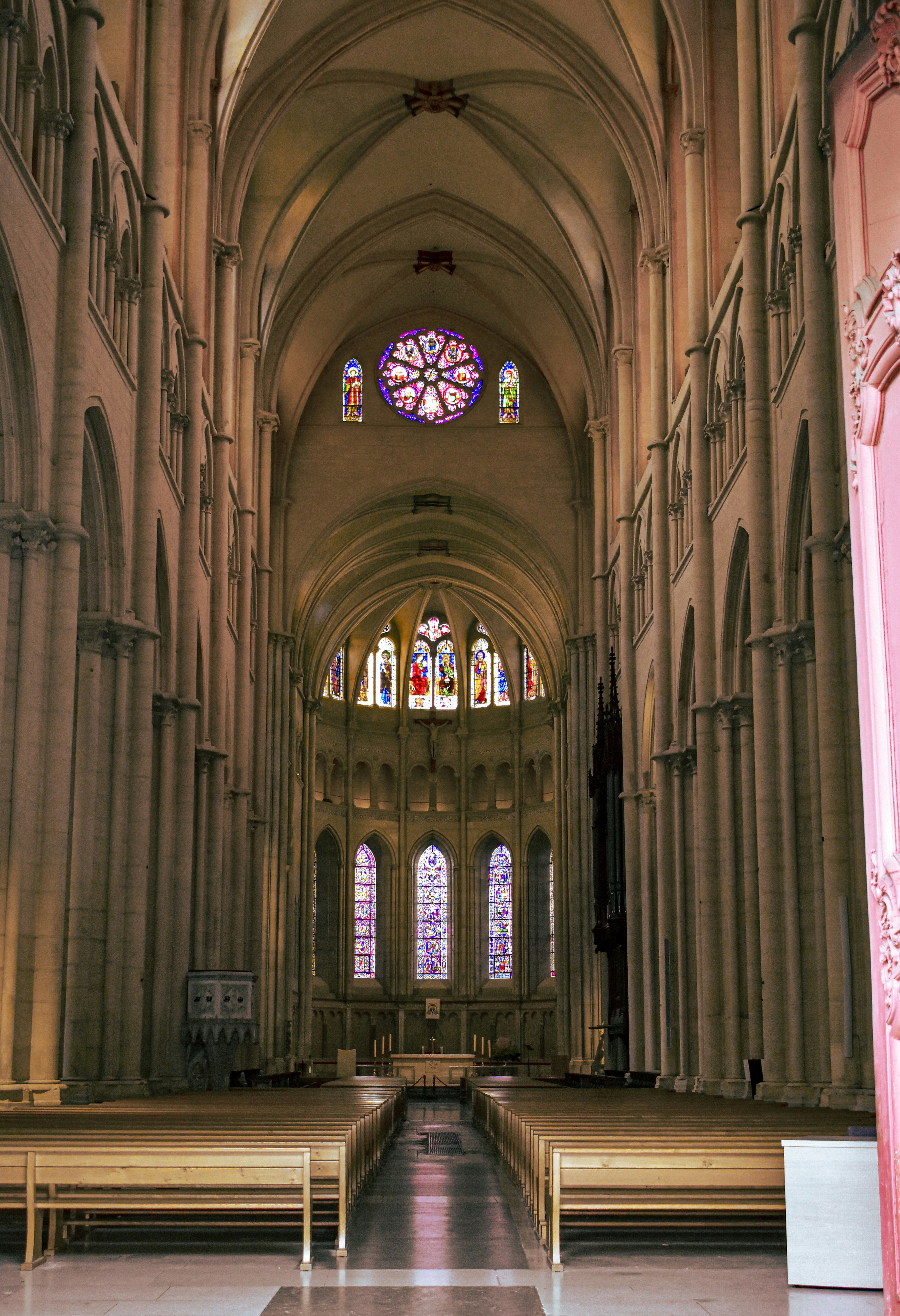 Aisle to the Apse: Stained Glass and Arched Silence
