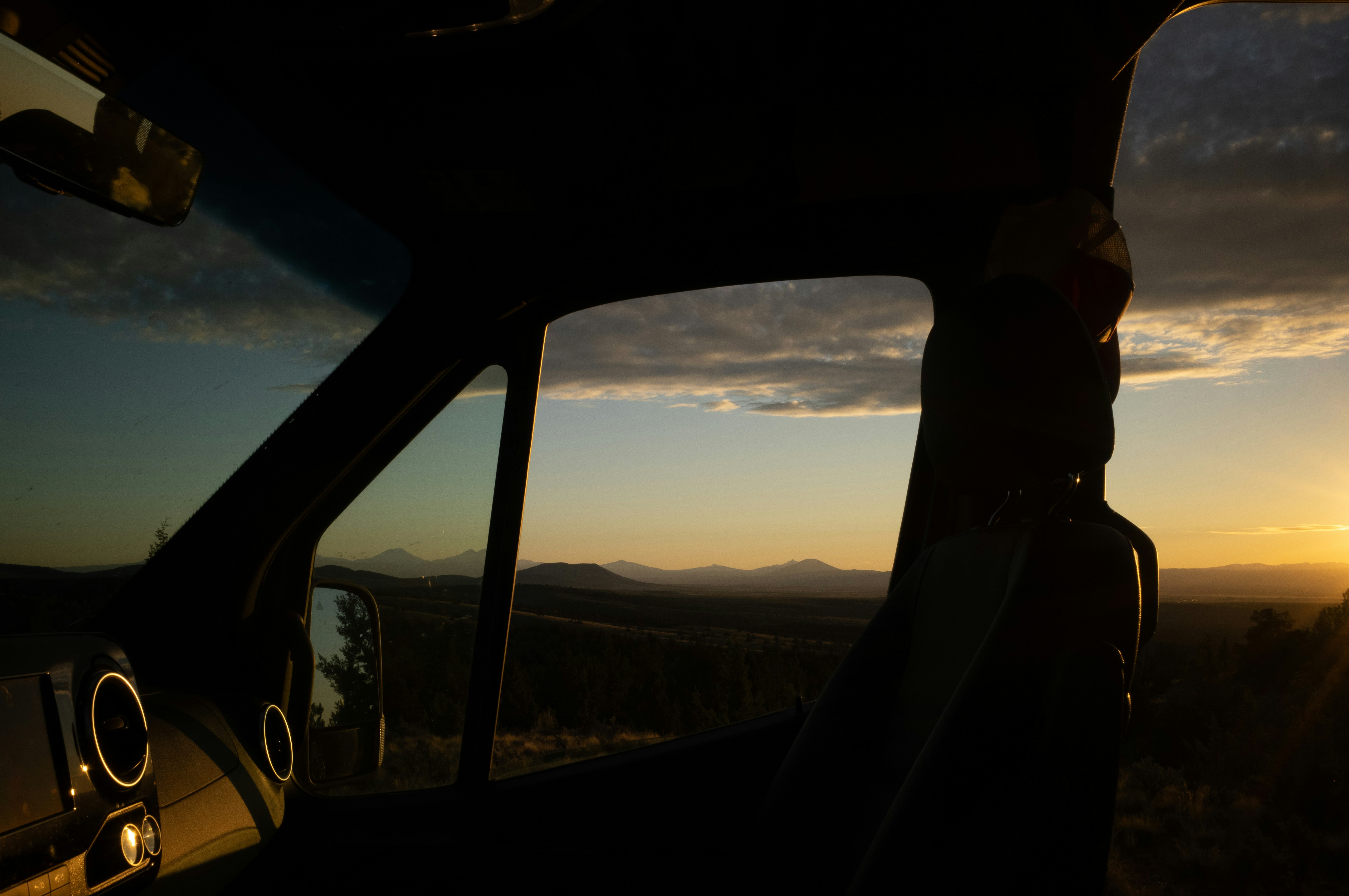 Window View at Dusk: Desert Horizon from the Driver’s Seat
